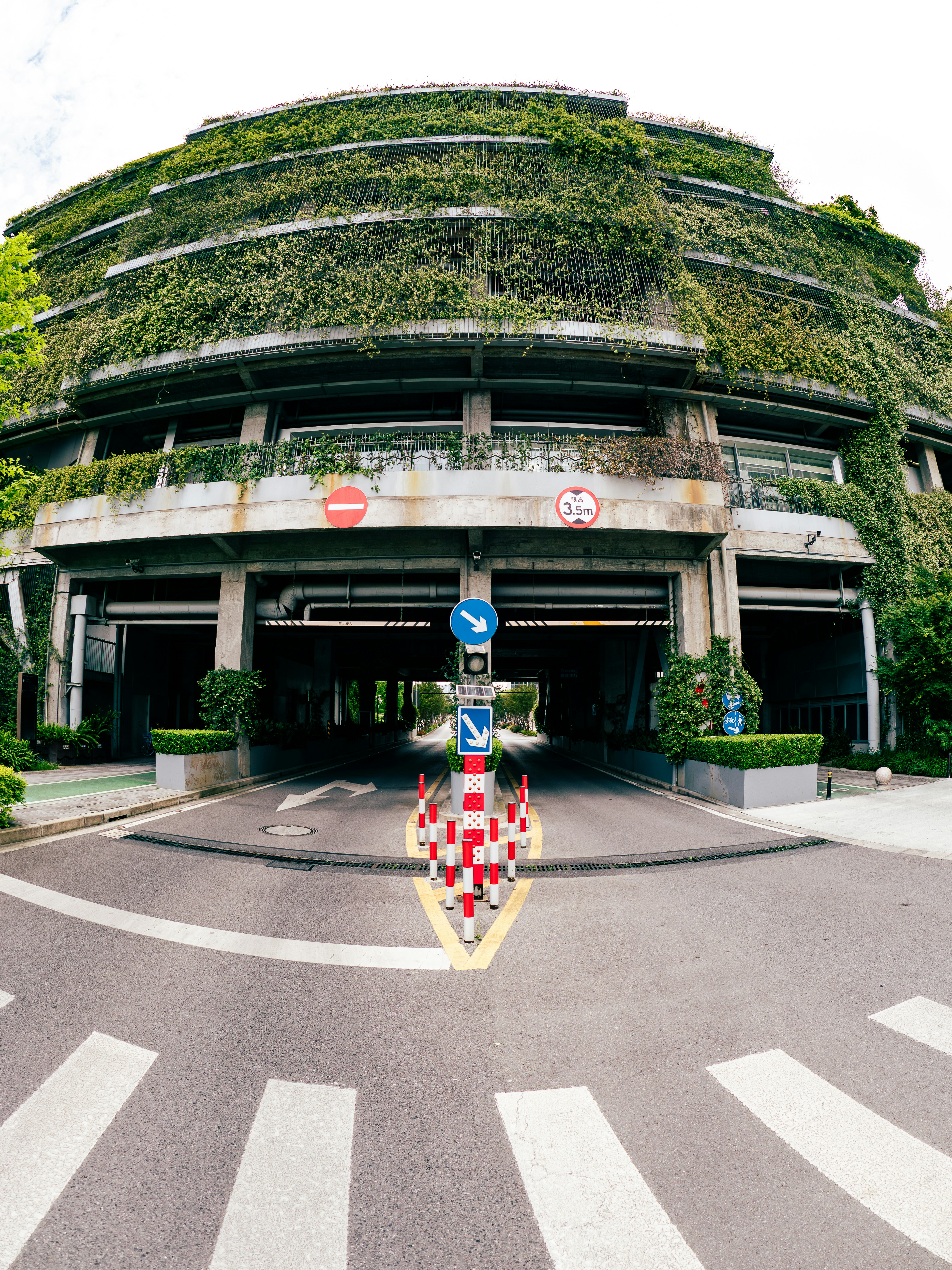 Vertical Atrium of Green Veil: Parking Portal Under a Living Wall