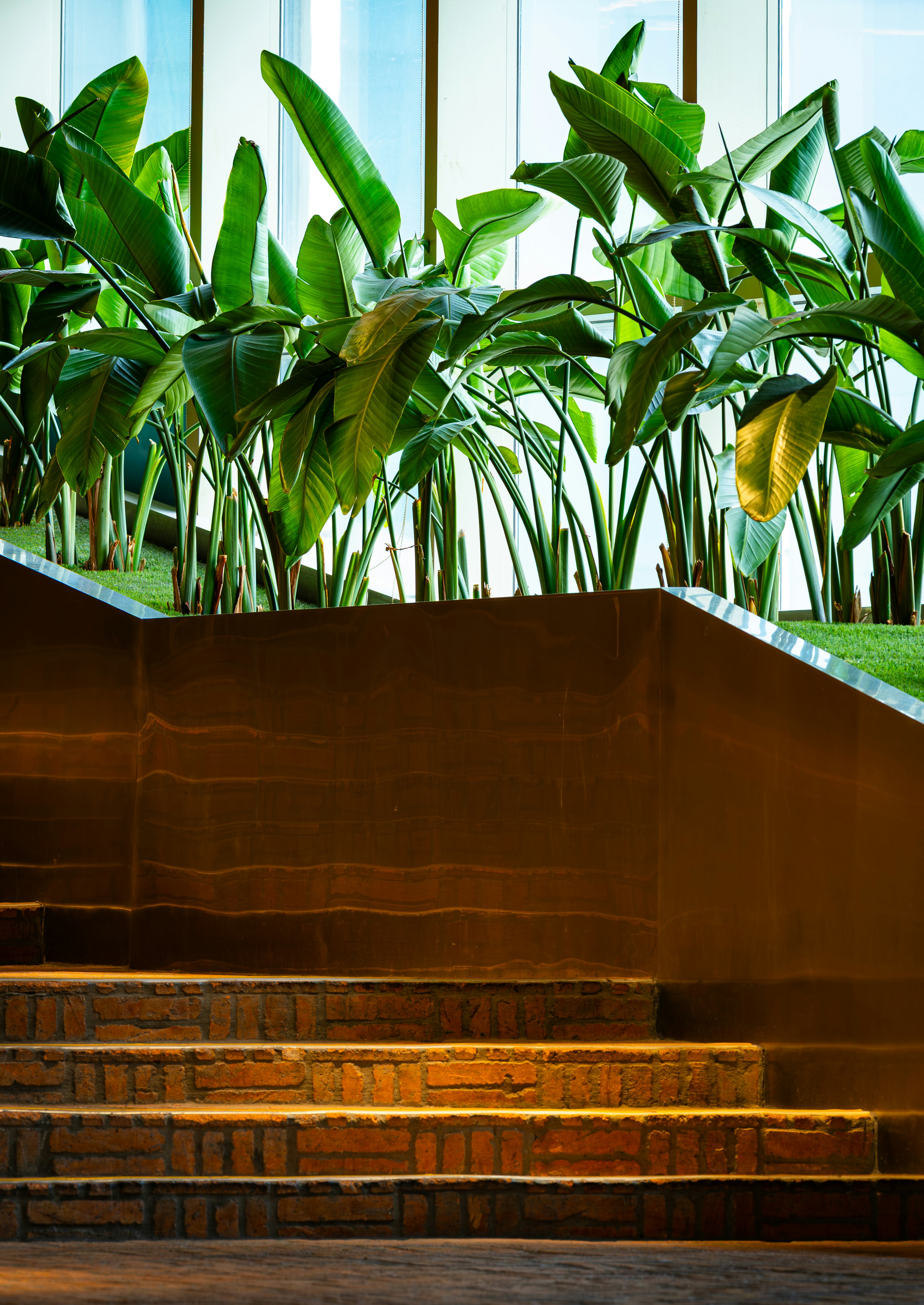 Green Rise: Planting Steel and Leaves Along Brick and Copper Steps