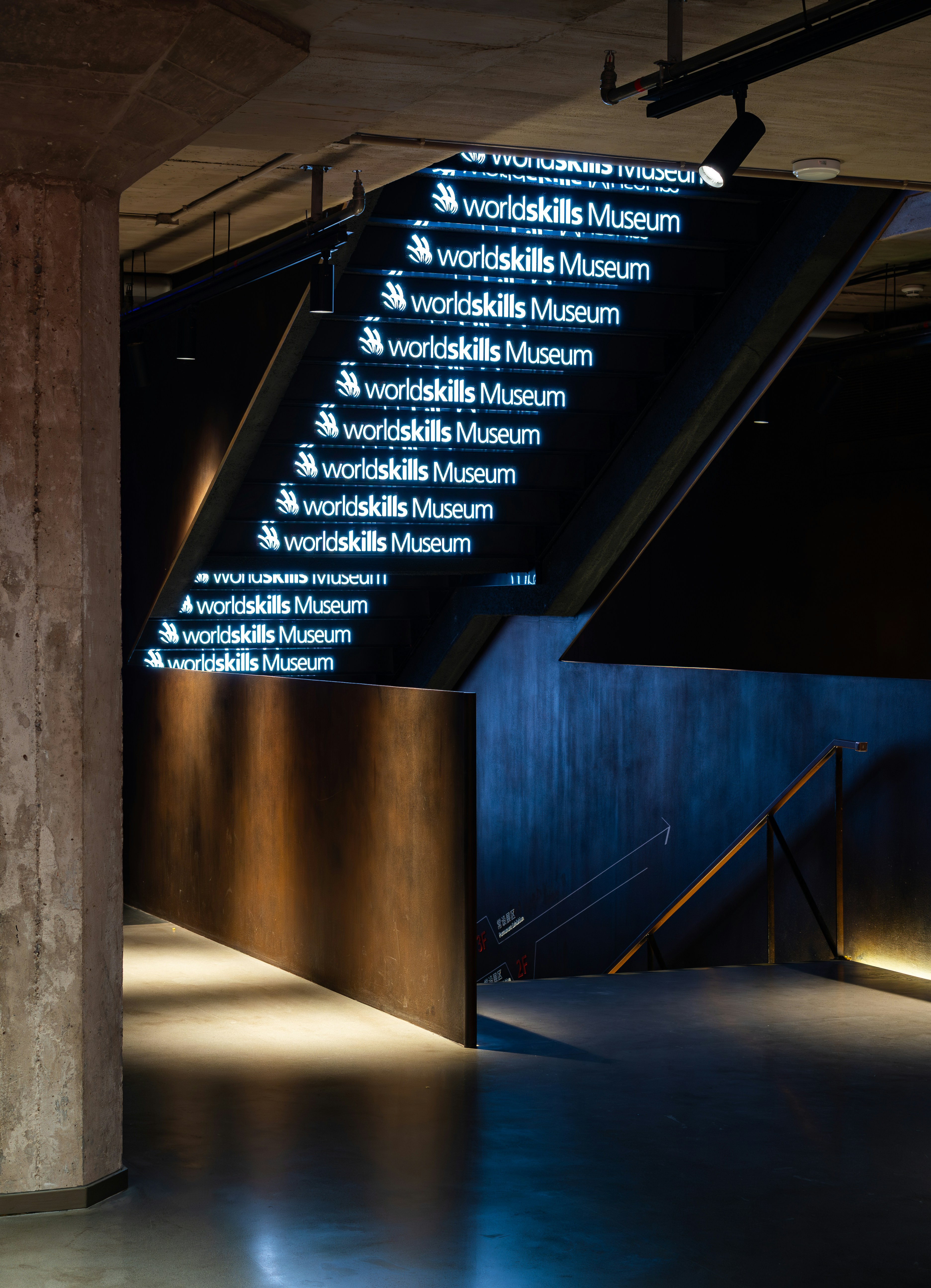 Neon stairs into the WorldSkills Museum night shift
