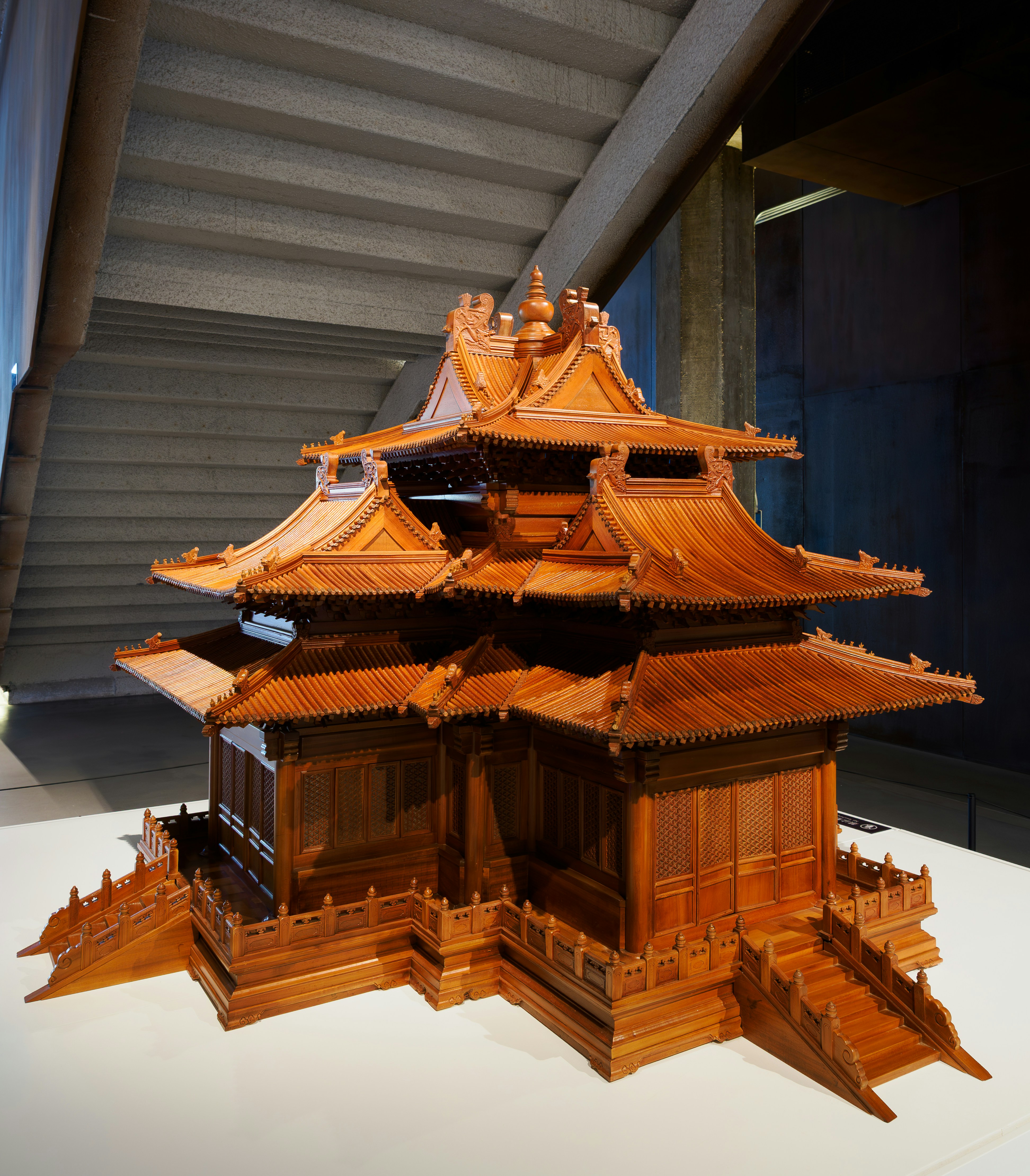 Ornate Timber Temple: A Delicate Woodwork in Modern Light