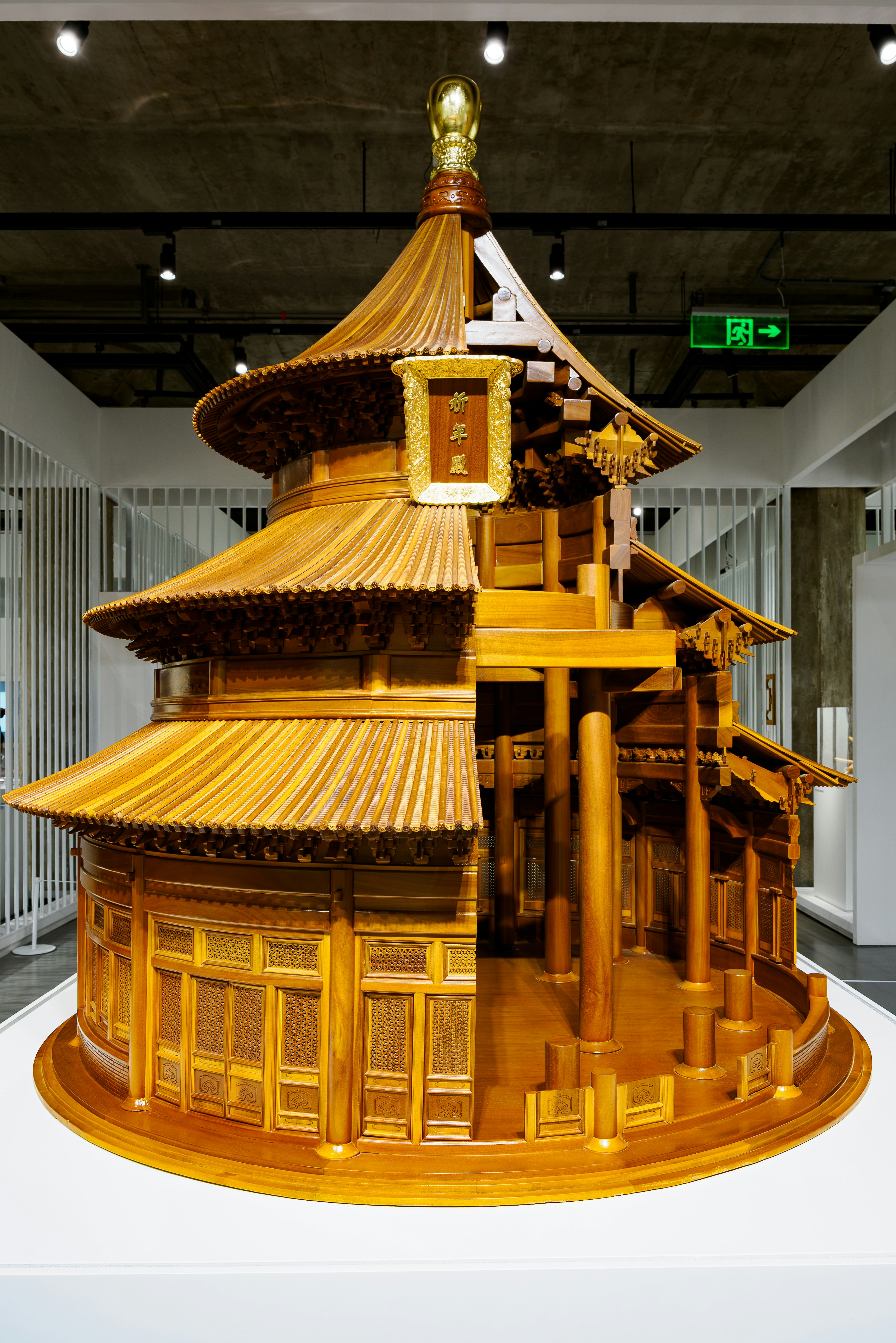 Detailed wooden model of a traditional multi-tiered building.
