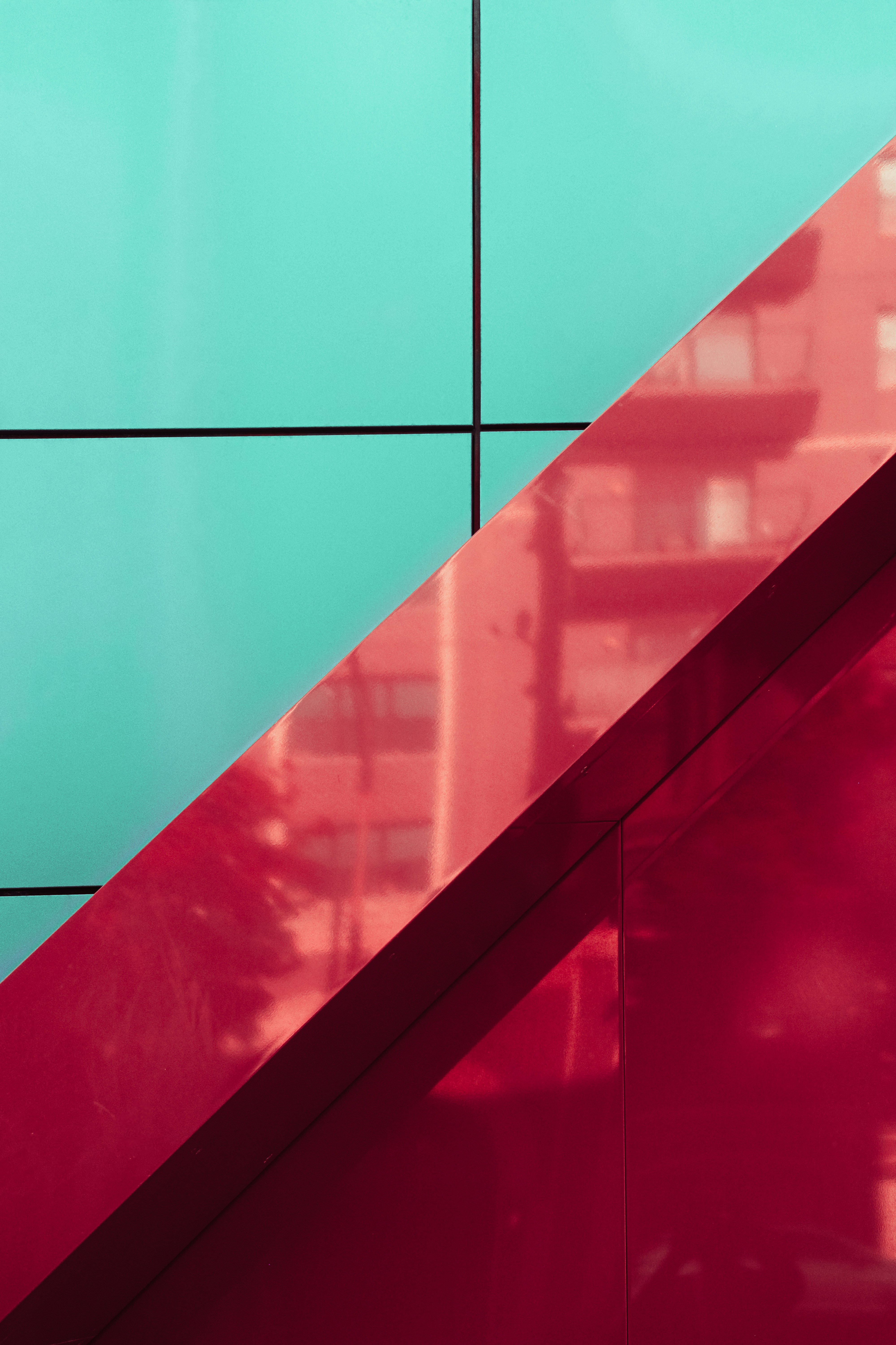 Diagonal Ribbon of Color: Neon Teal Meets Crimson Glass