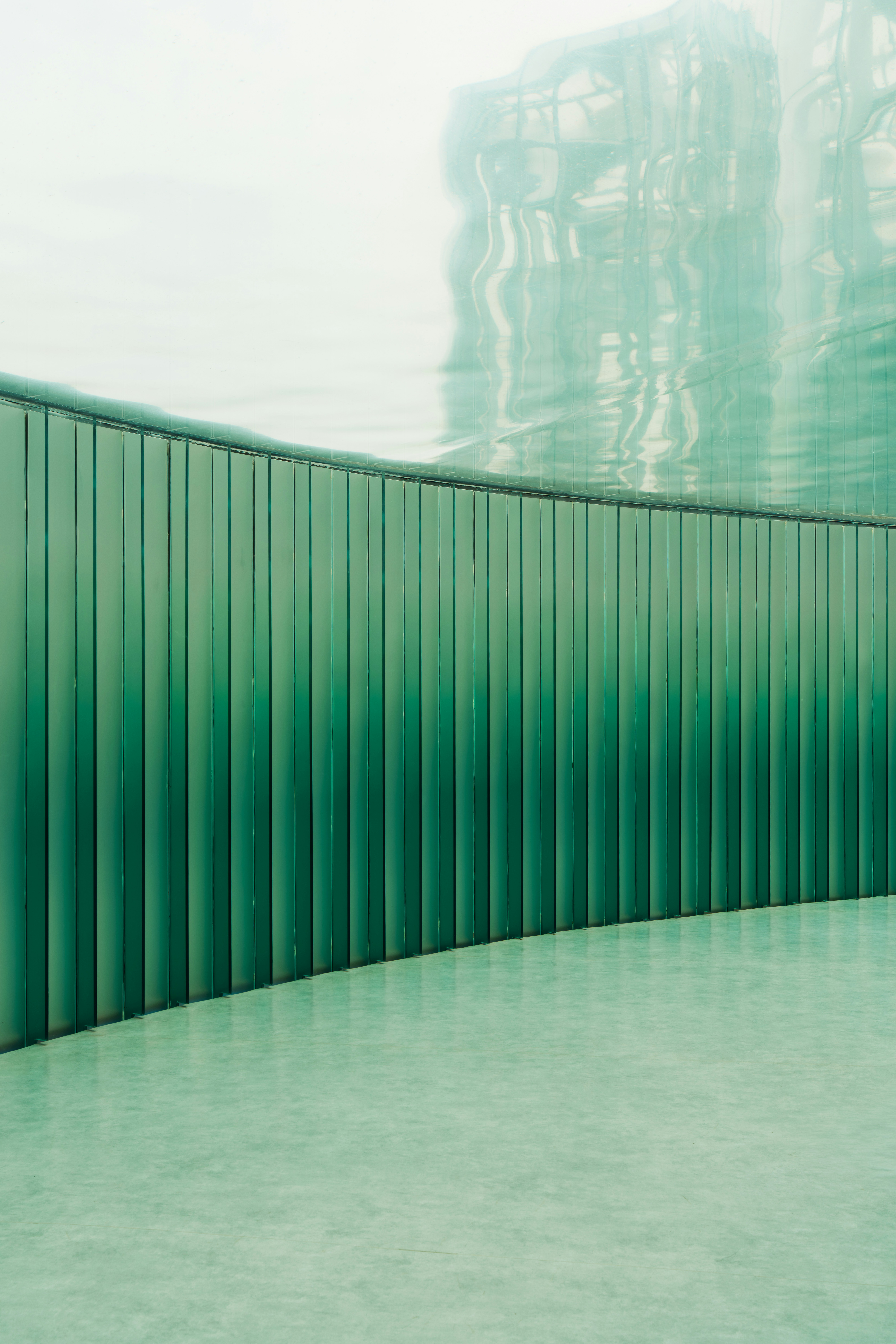 Reflections over a Seam of Glass and Steel