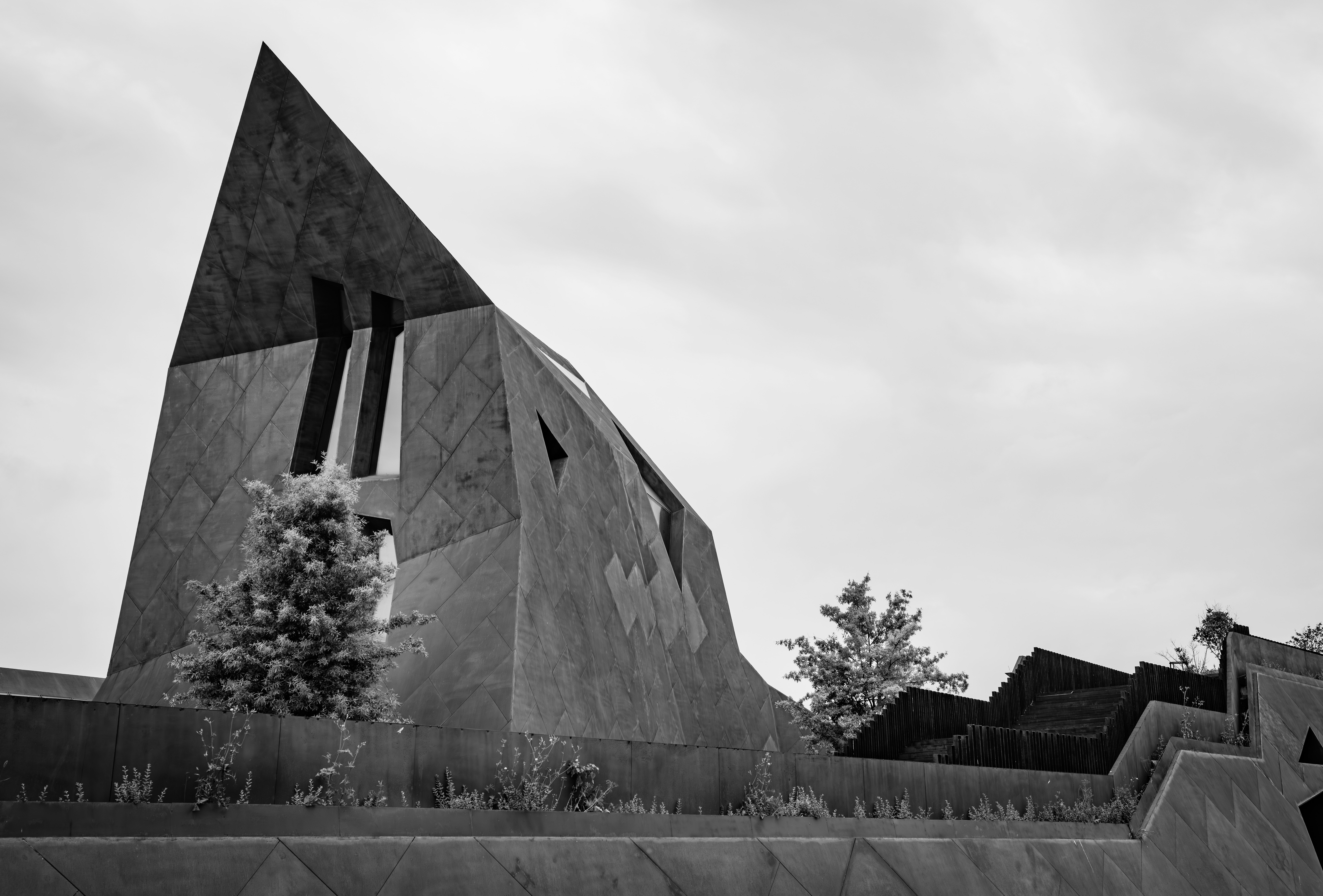 Monolithic Geometry: Concrete Facade Reaching Toward the Sky