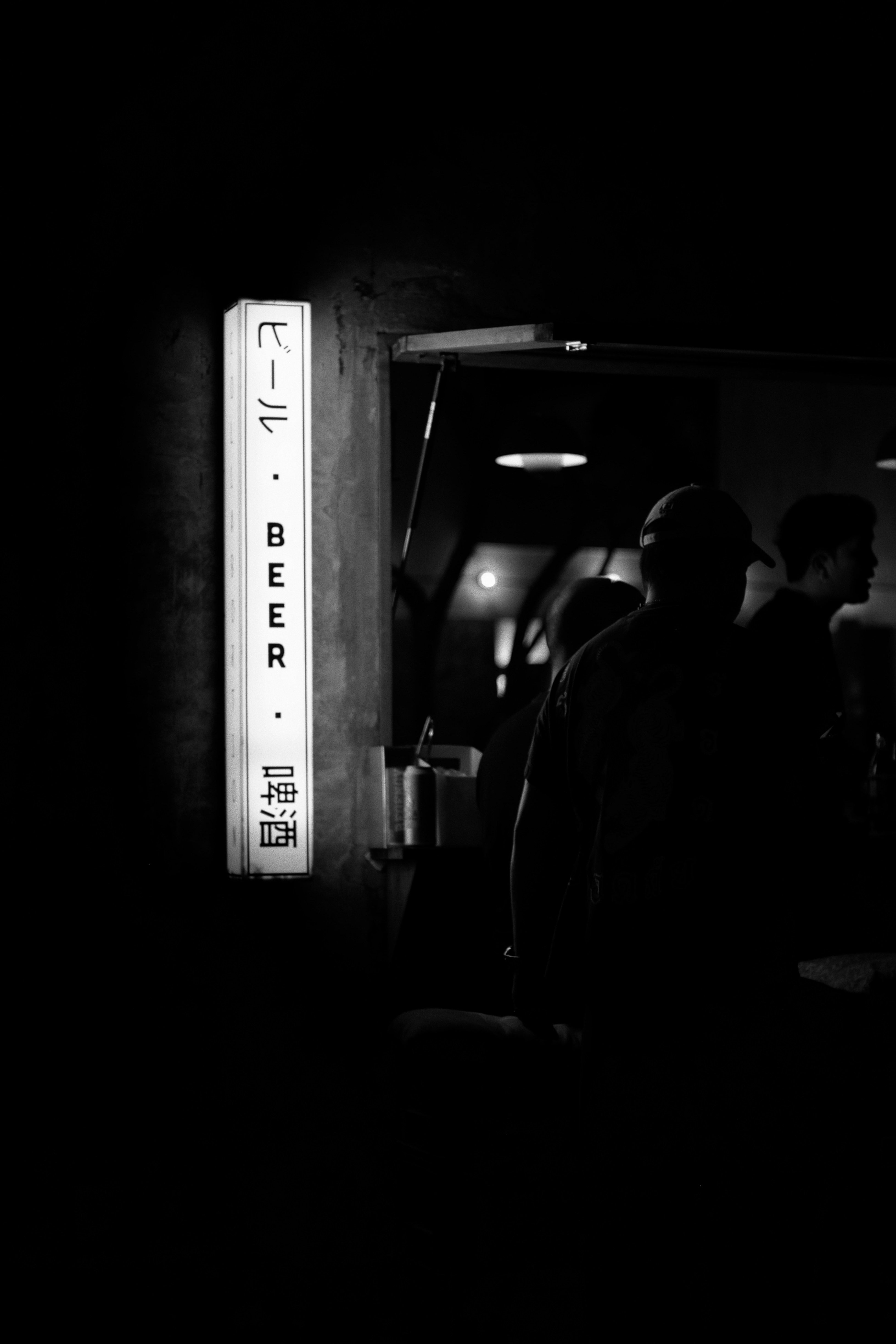 Neon Sign and Shadowed Alleyway