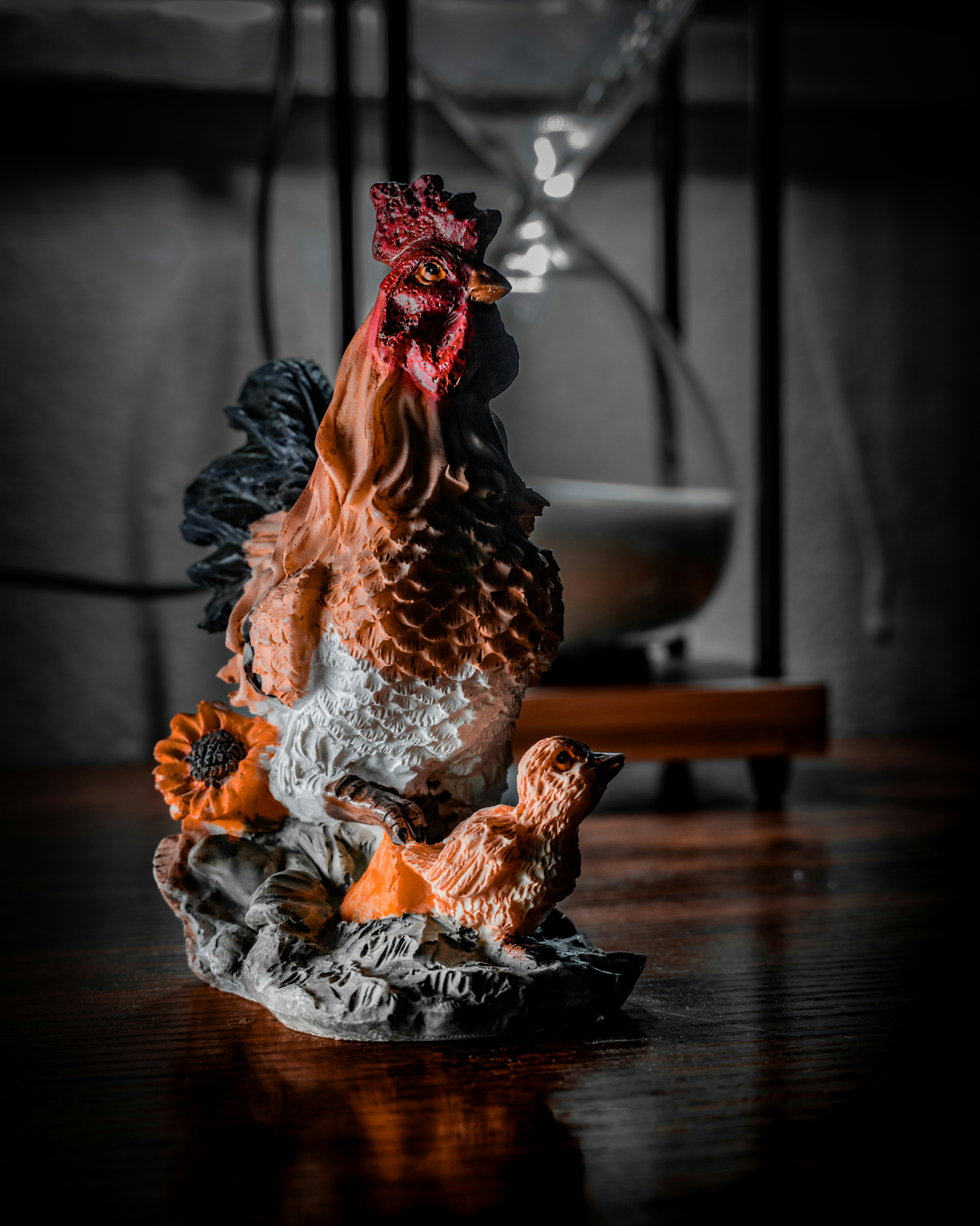 Hen and Chick Figurine under Spotlight