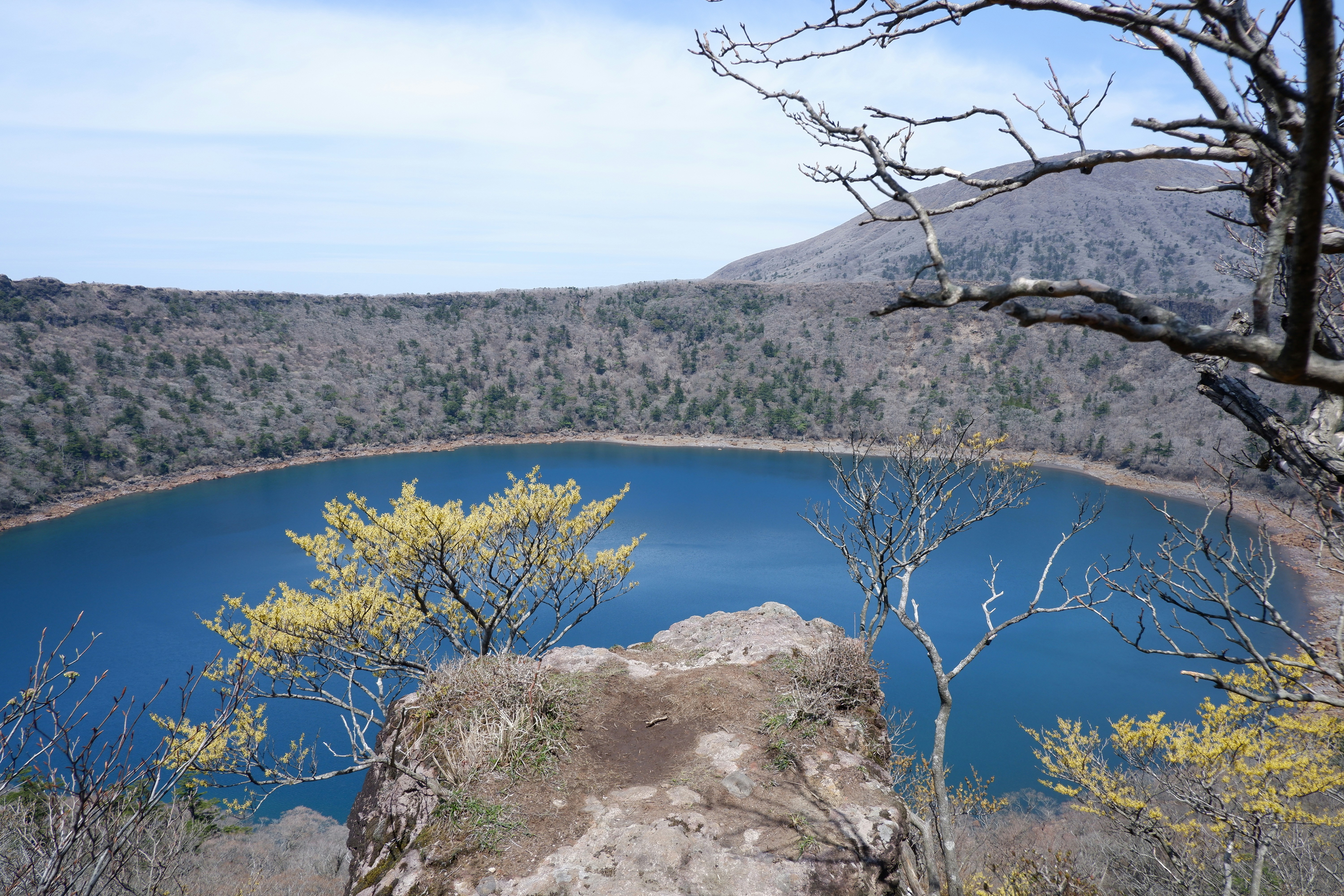 Clifftop View Over a Quiet Blue Crater Lake