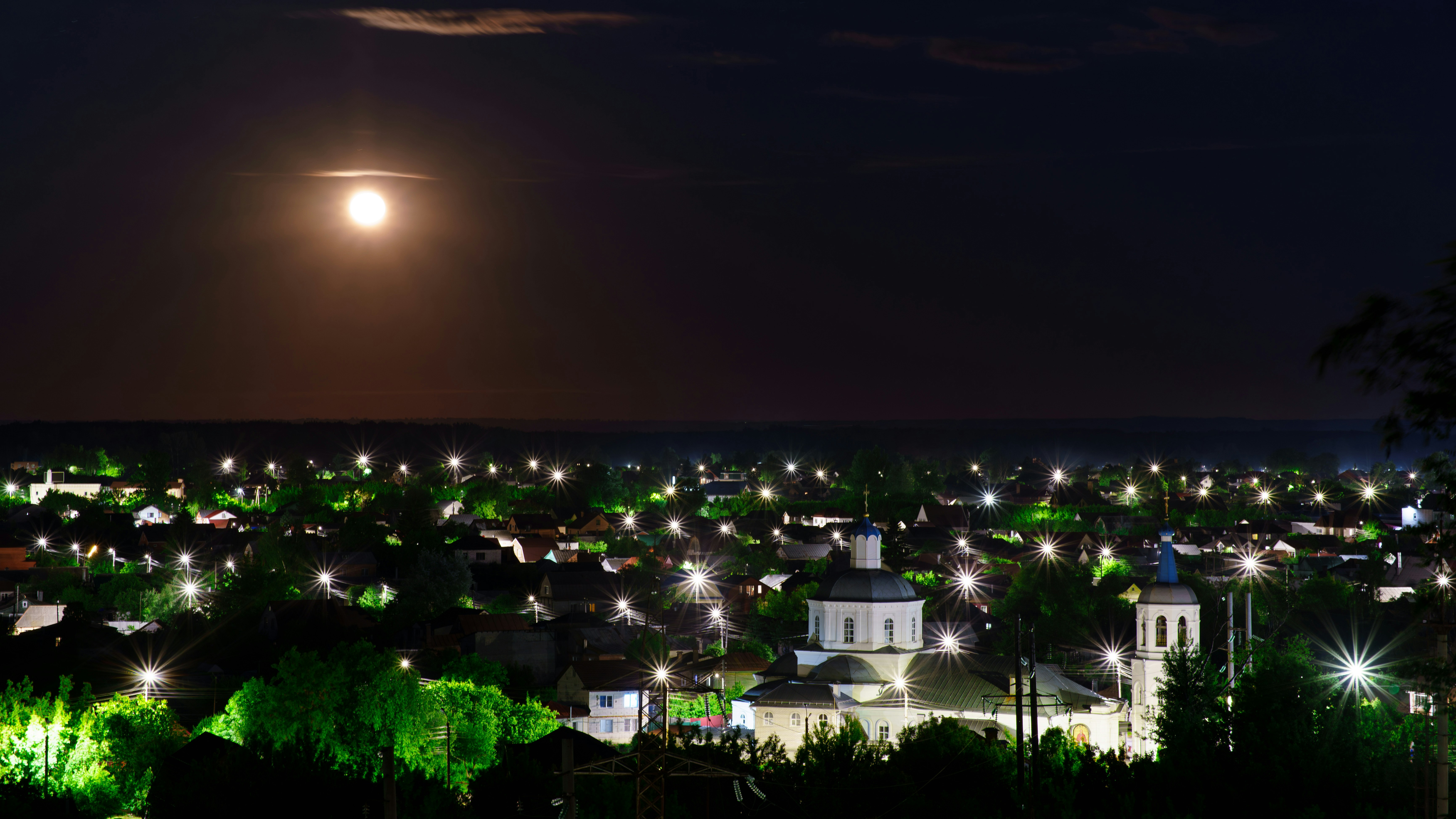 Moonlit Horizon Over a Quiet Town