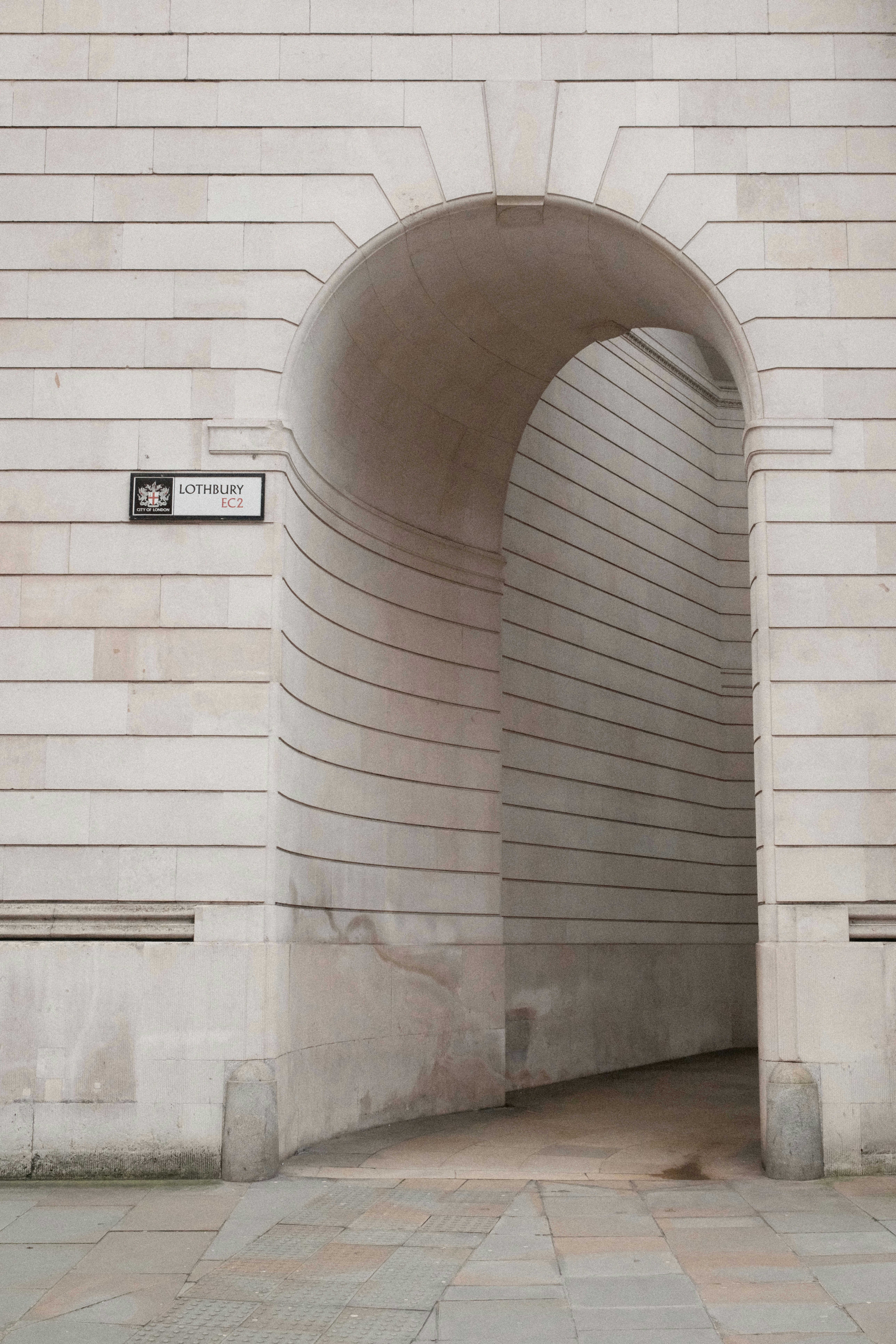 Archway into Light: A Quiet Street Through Stone Corridors