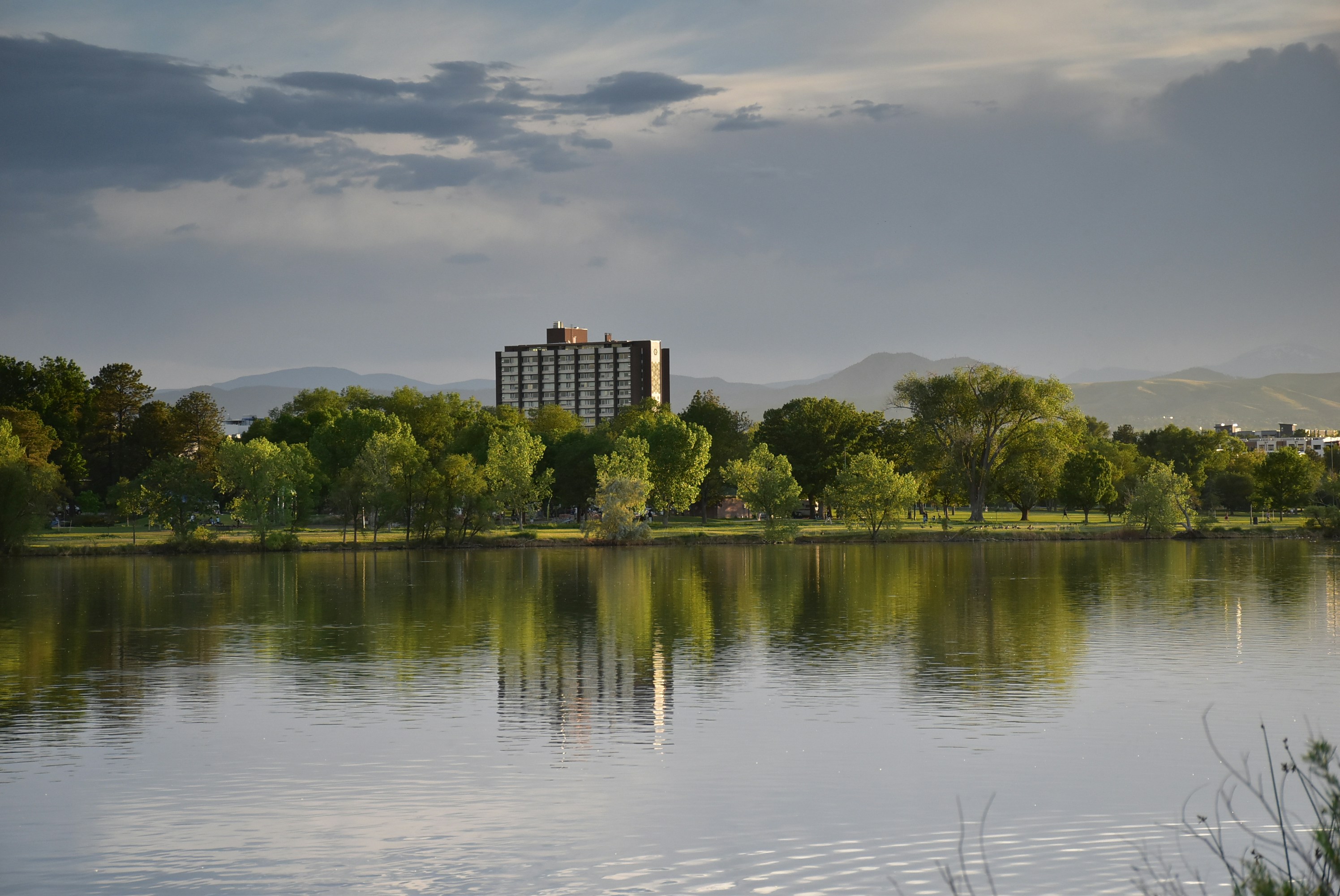 Lakeside Monolith: A solitary tower among the green banks