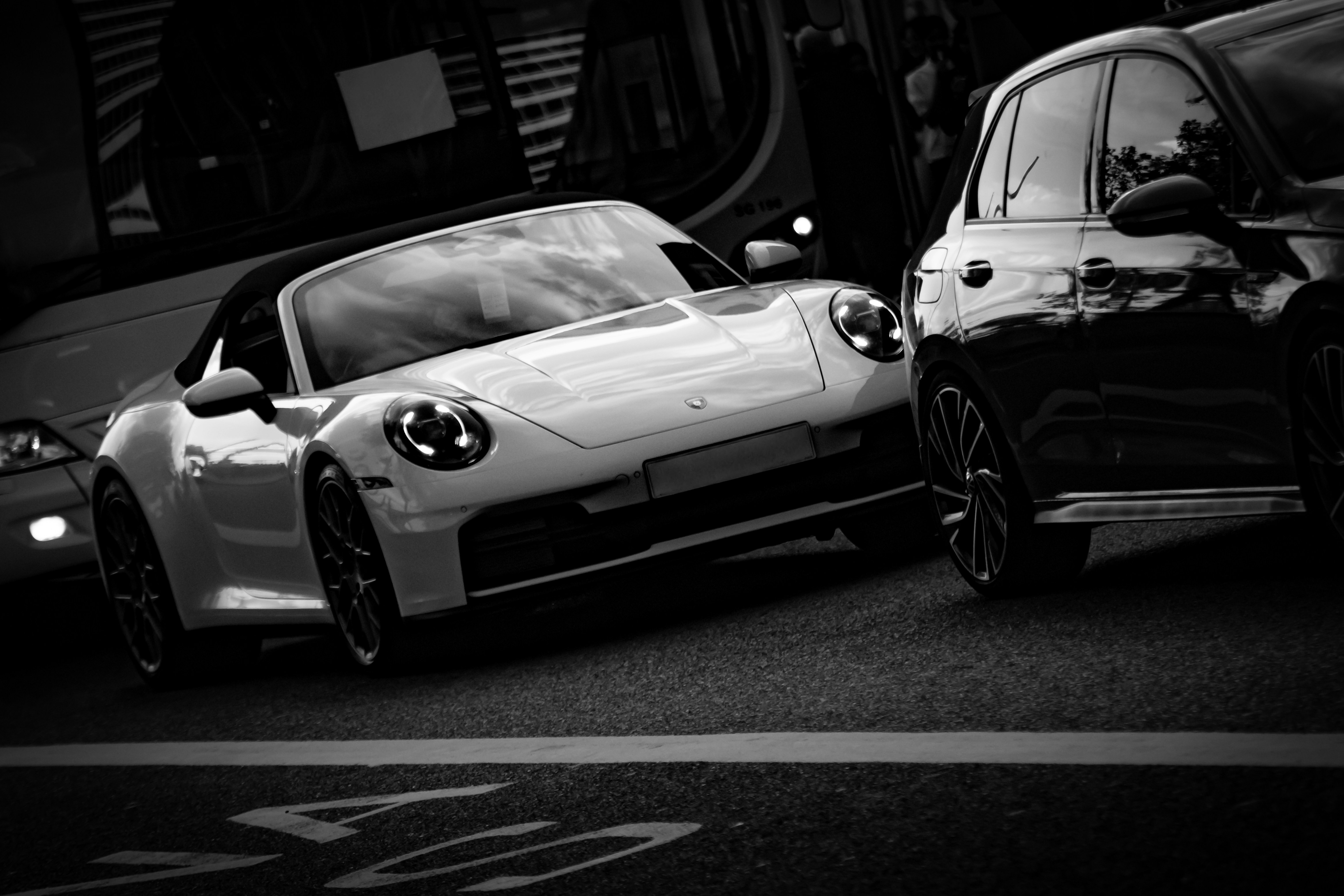 Midnight Lineup: A Porsche Stands Out among Urban Reflections