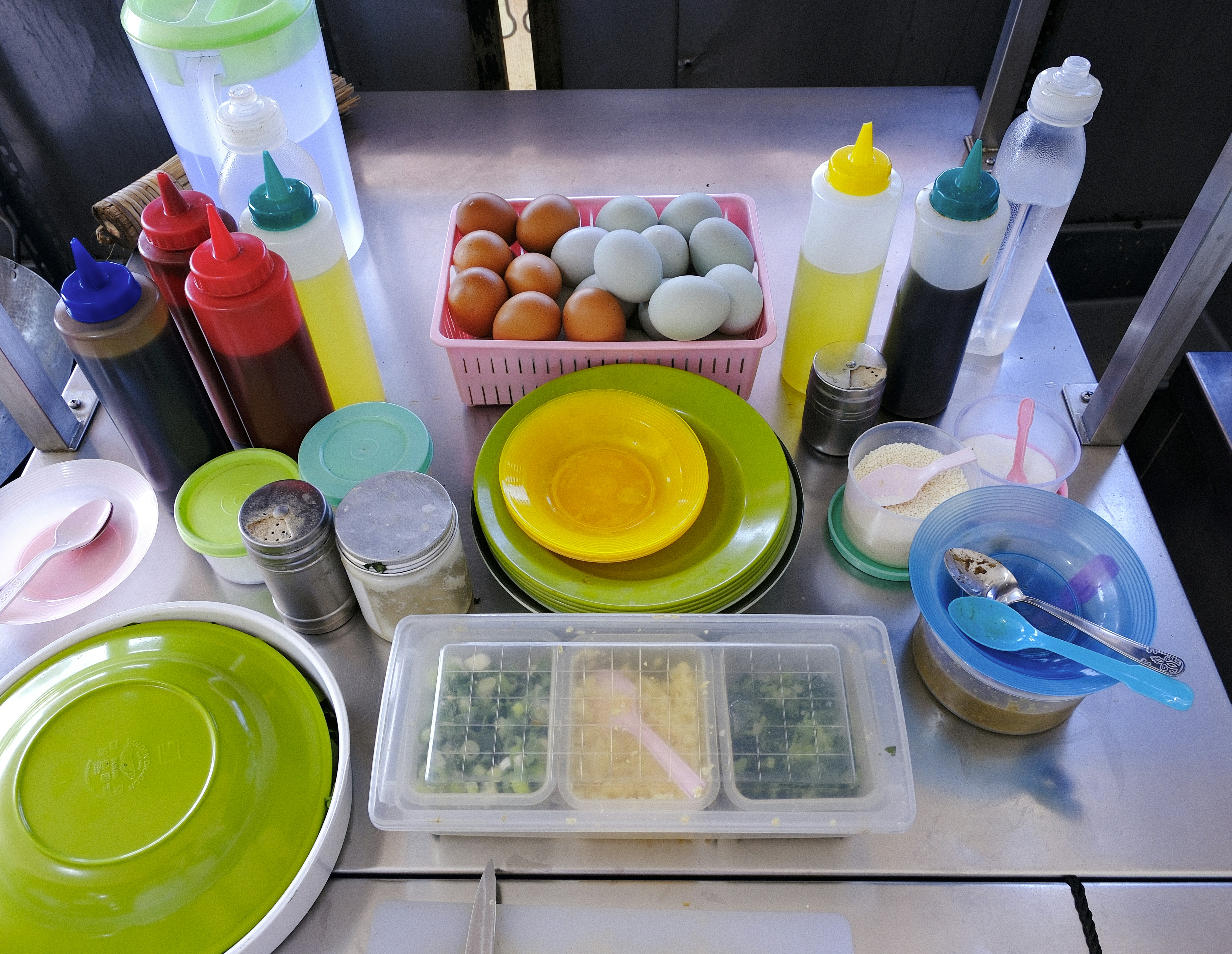 Colorful Kitchen Studio: Array of Squeezed Bottles and Fresh Eggs
