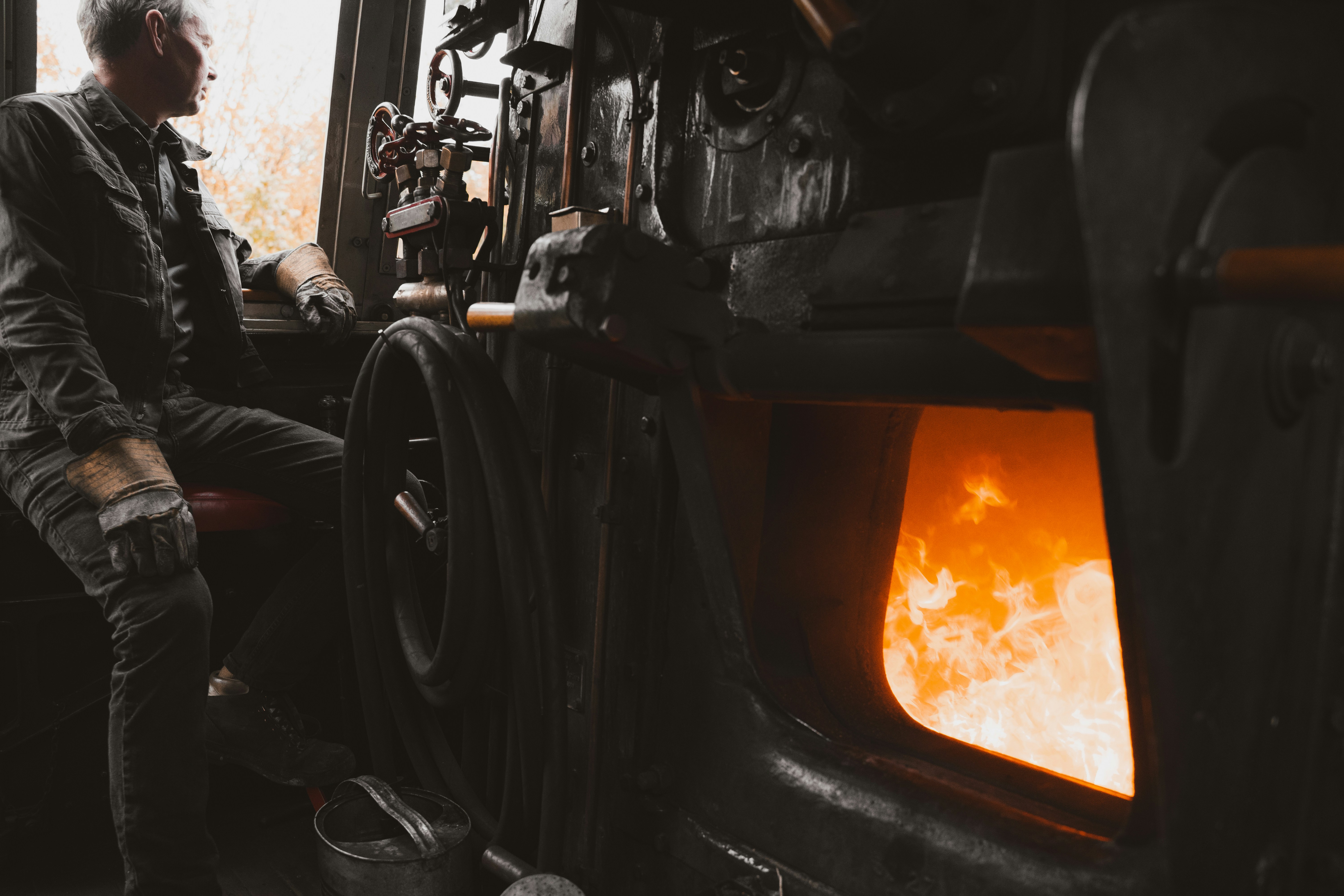 Forge Worker at the Hearth: Close-Cropped Portrait in a Steel Mill