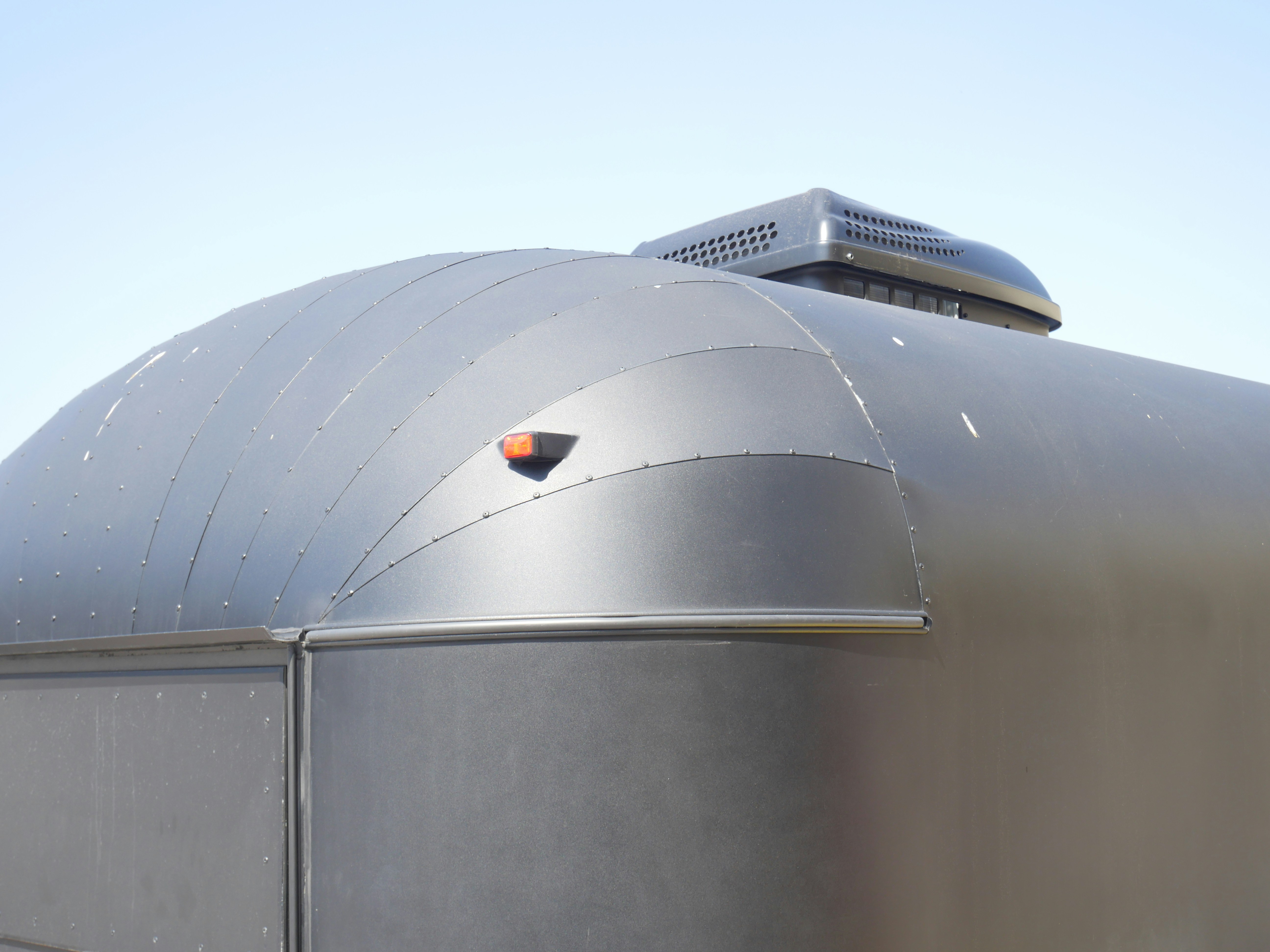 Airstream Rooftop: Vent and Ventral Curves on a Metal Trailer