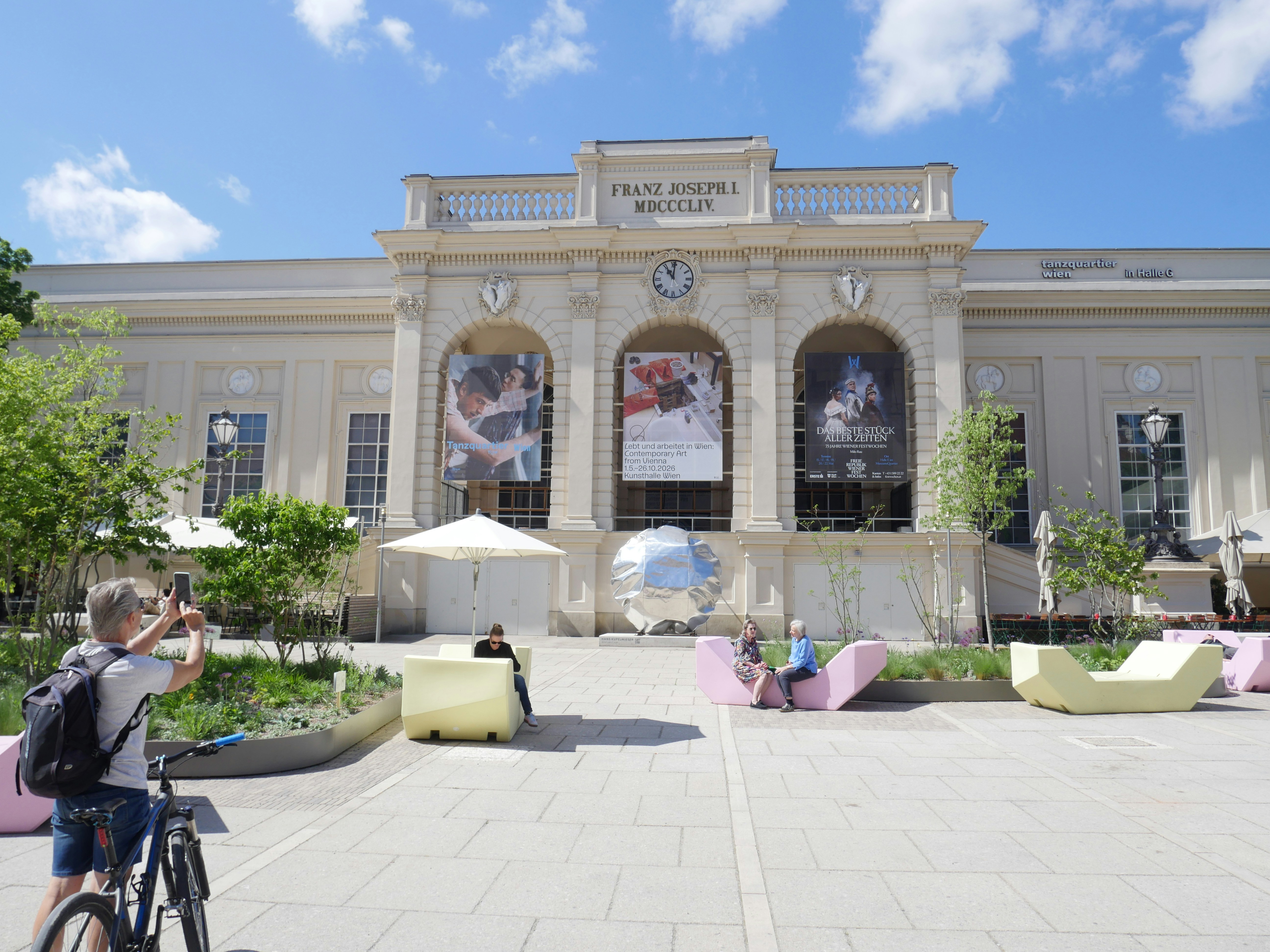 Museum Courtyard Awakens: Sunlit Facade and Social Corner