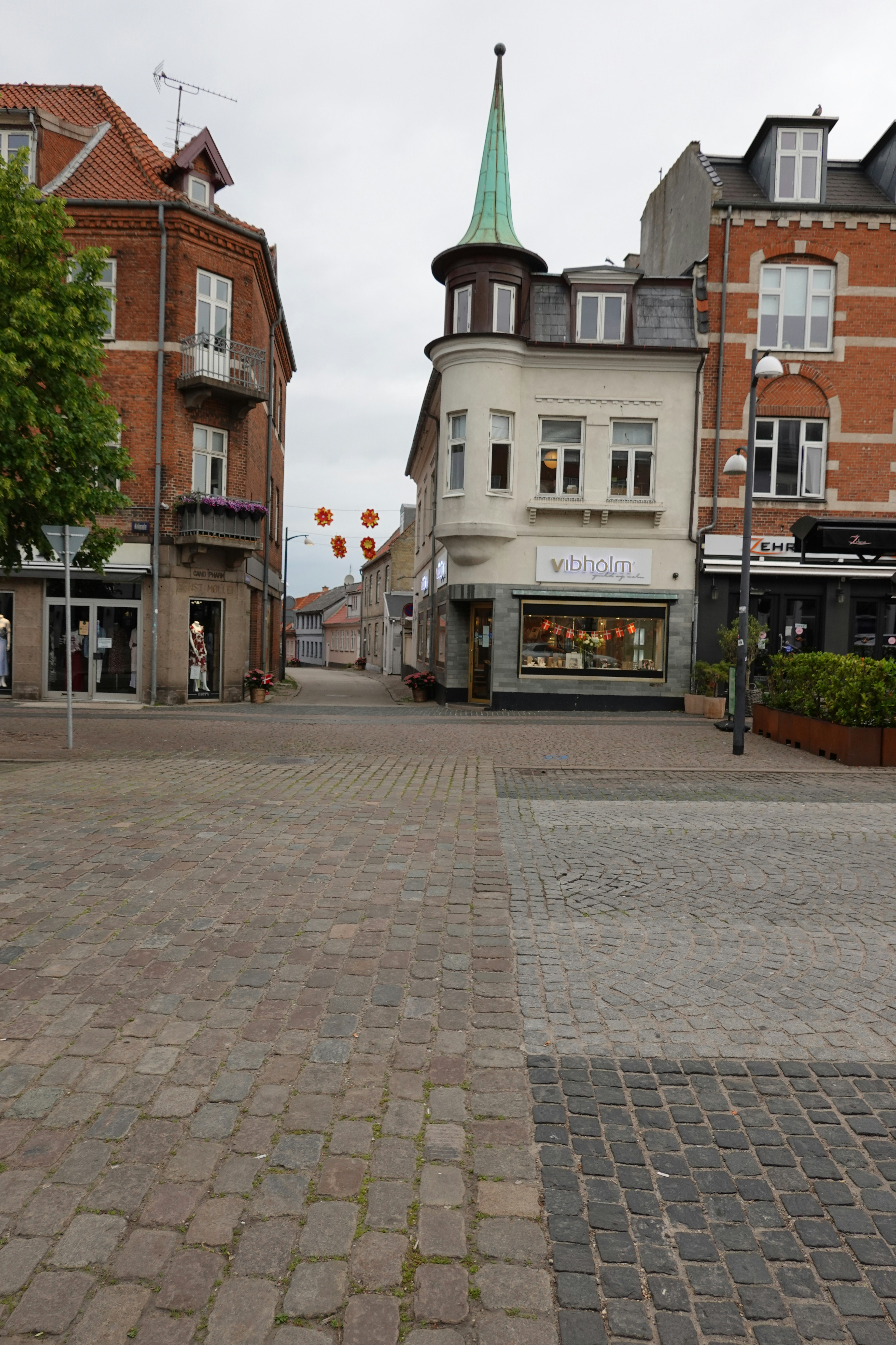 Curved Turret Overlooking a Cobblestone Street