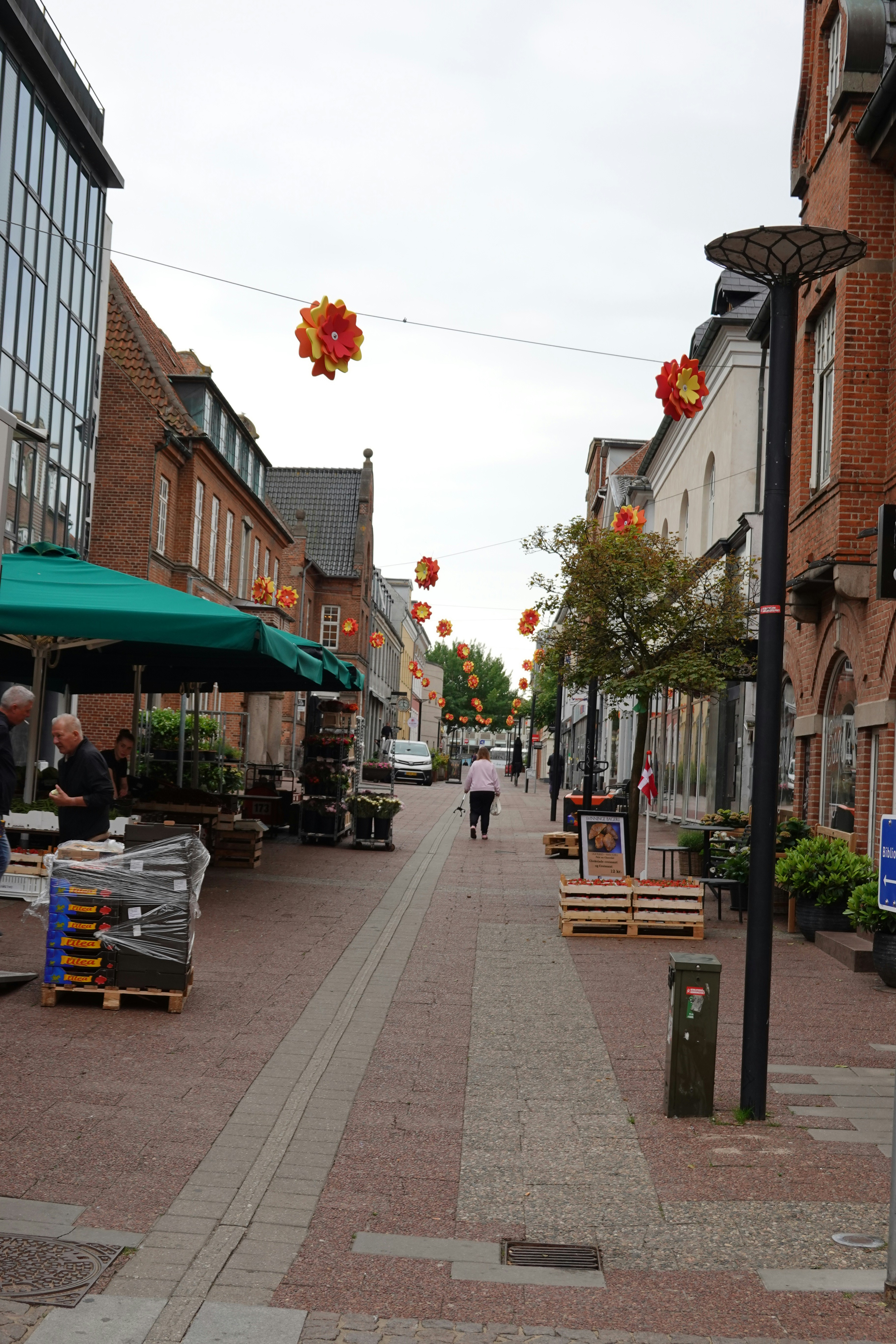Evening Market Street: lanterns along a quiet urban avenue
