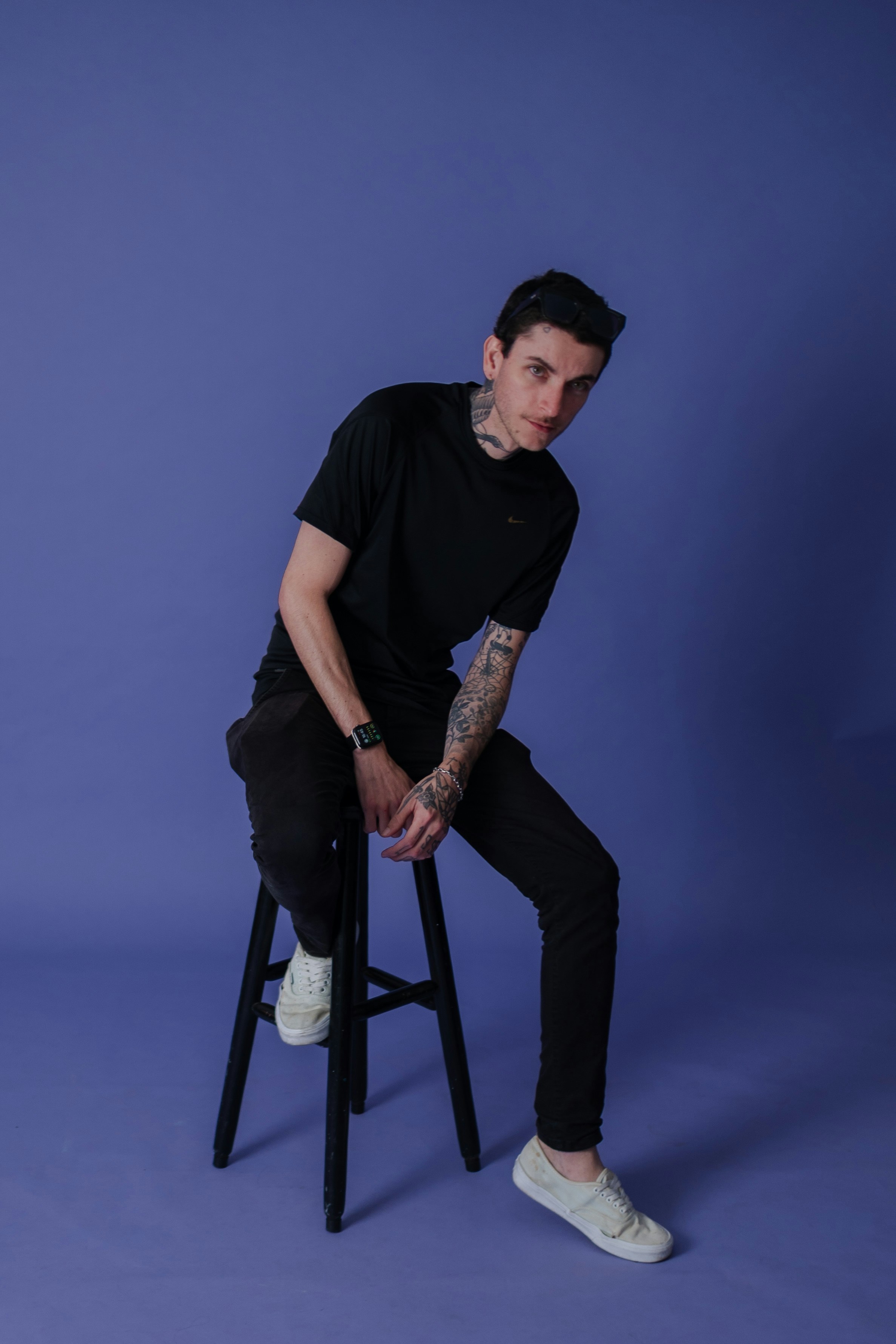 Midnight Blue Studio: A relaxed chair-side portrait with a tattooed subject