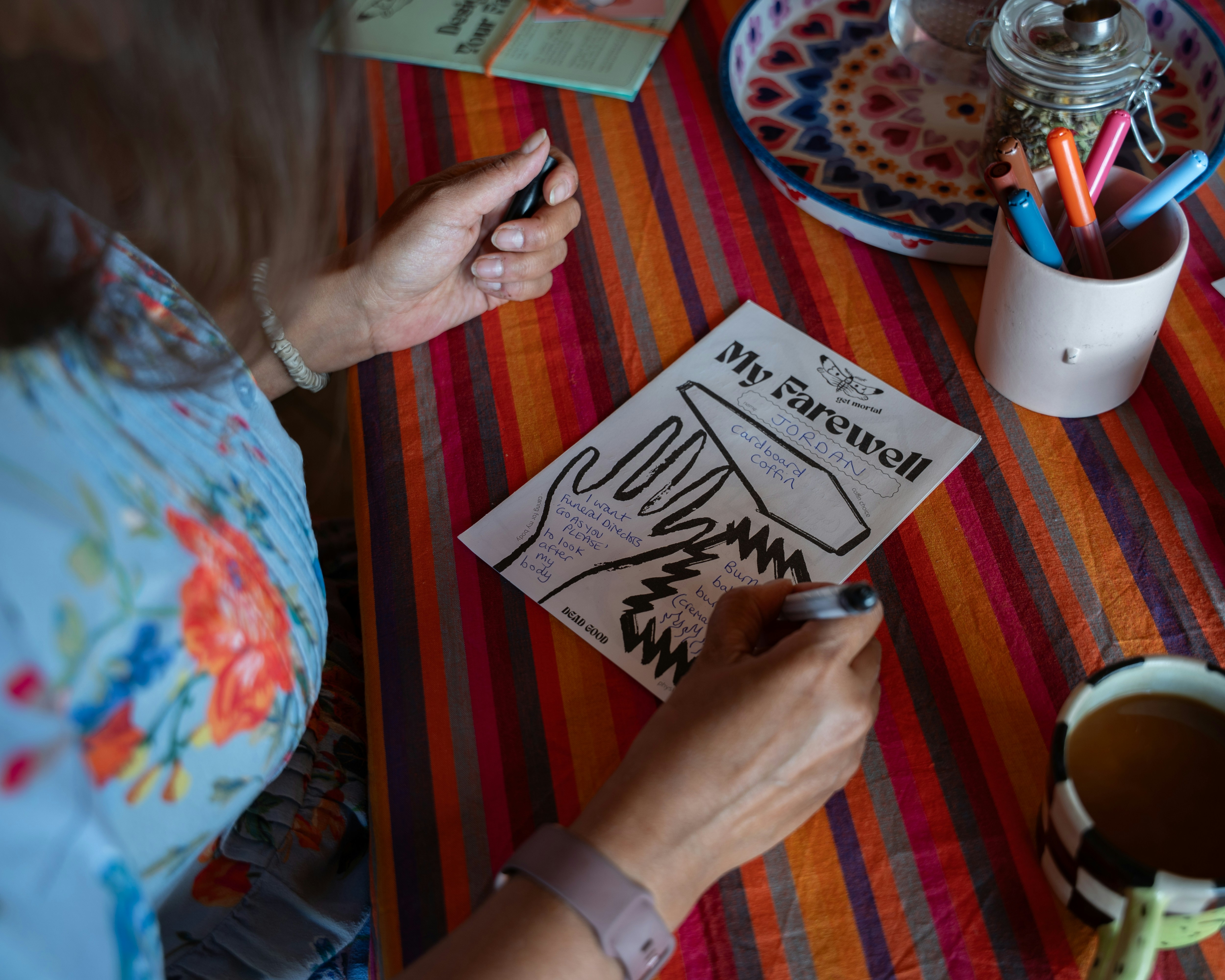 Hand-drawn Whimsy: Creating a Feathery Sketch on a Striped Table