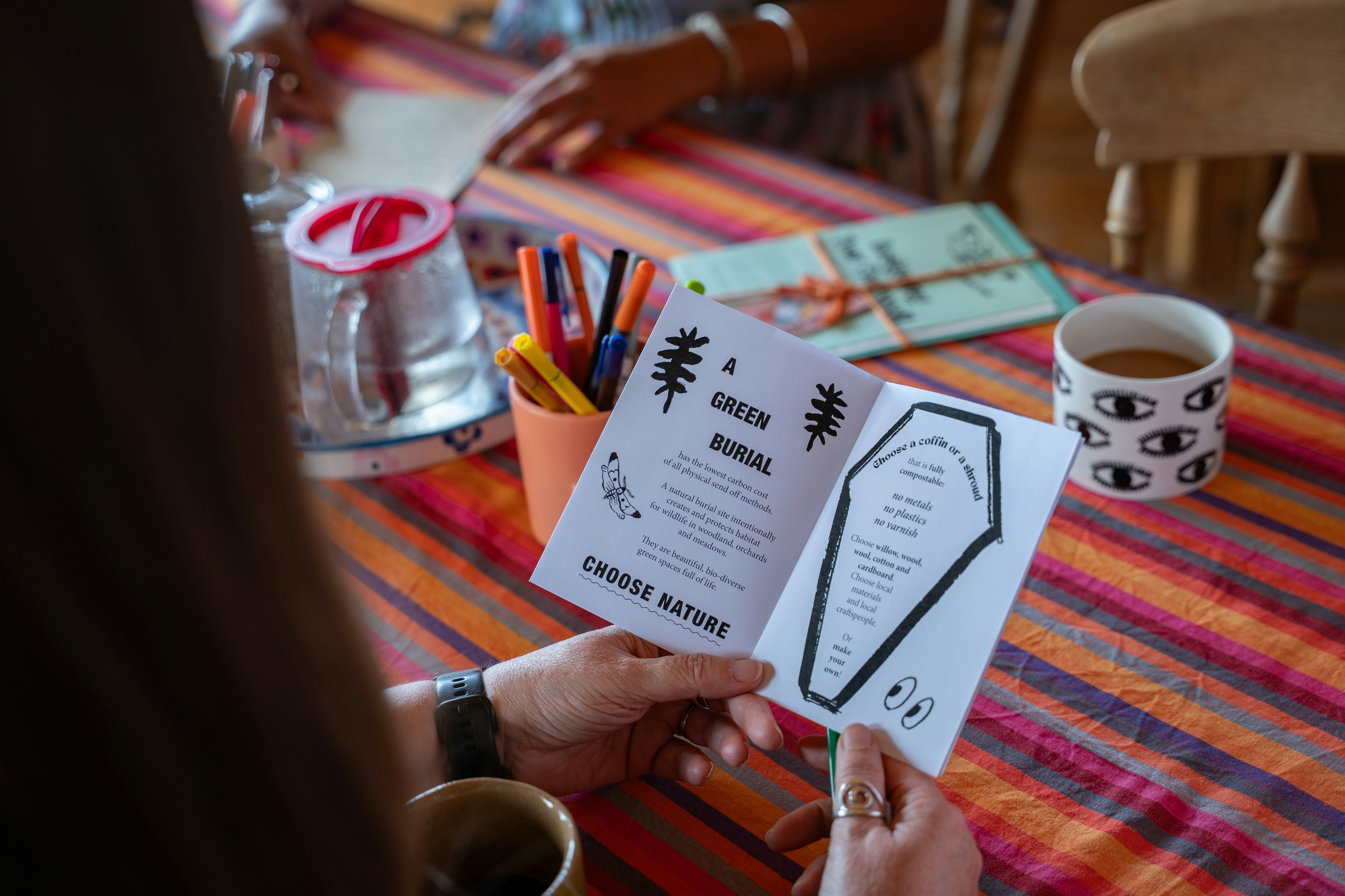 Whimsical Funeral Card Reading at a Striped Table