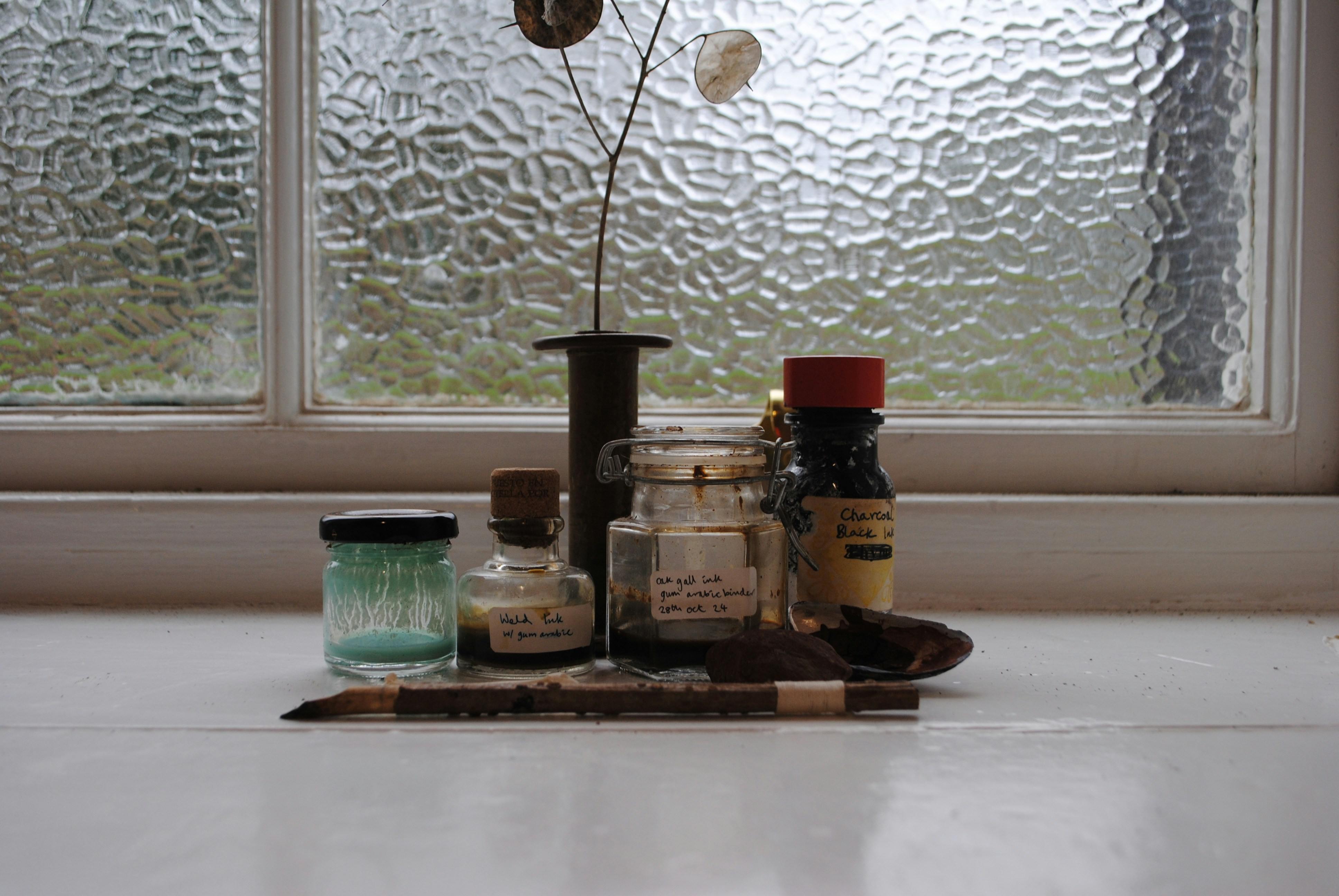 A Quiet Alchemy: Shelves of Bottles on a Windowsill