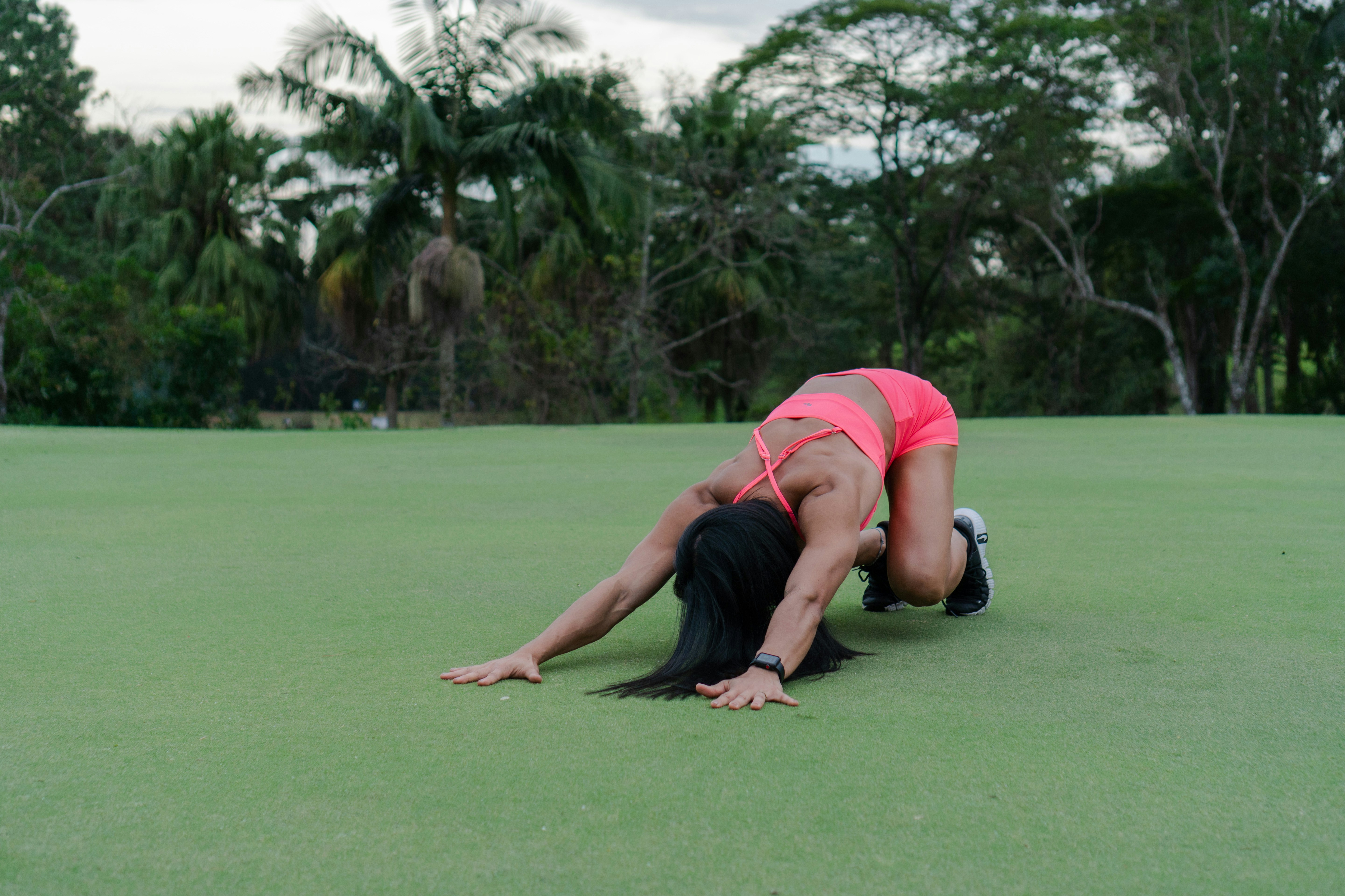 Downward Pose on the Green: Athlete in a Backbend