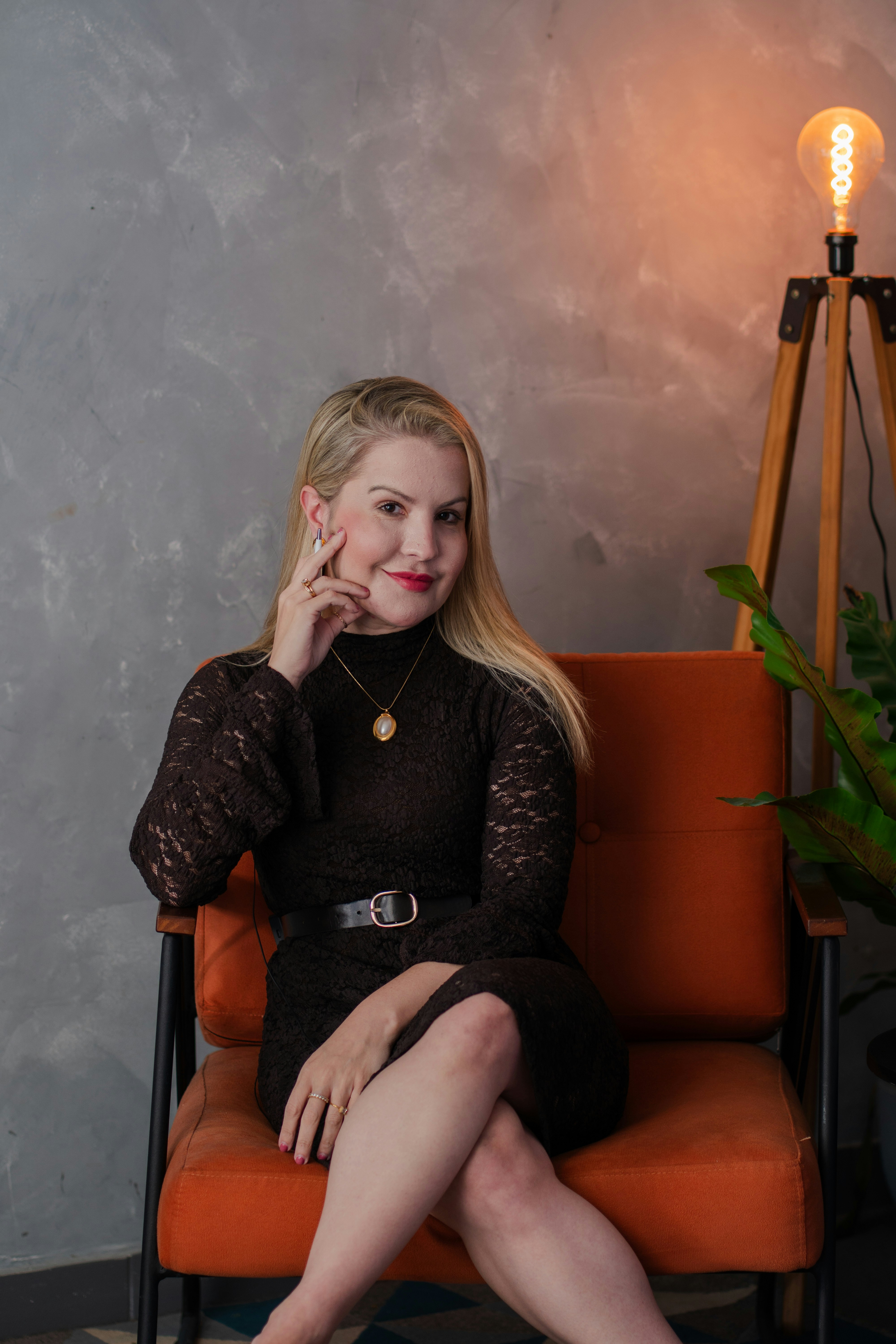 Graceful repose: a poised portrait in warm studio light