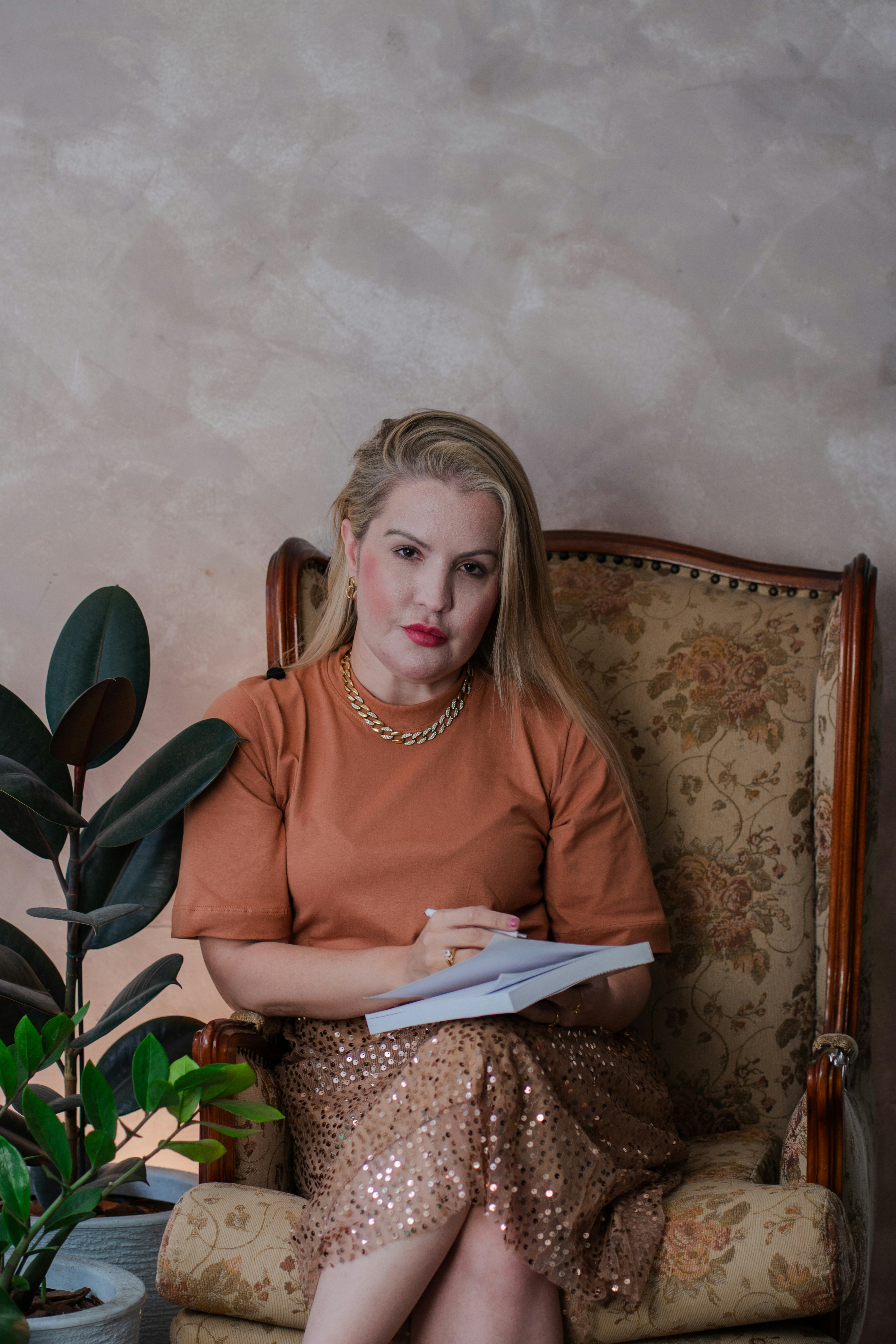 Portrait in a Quiet Studio: A Seated Writer in Velvet and Bronze