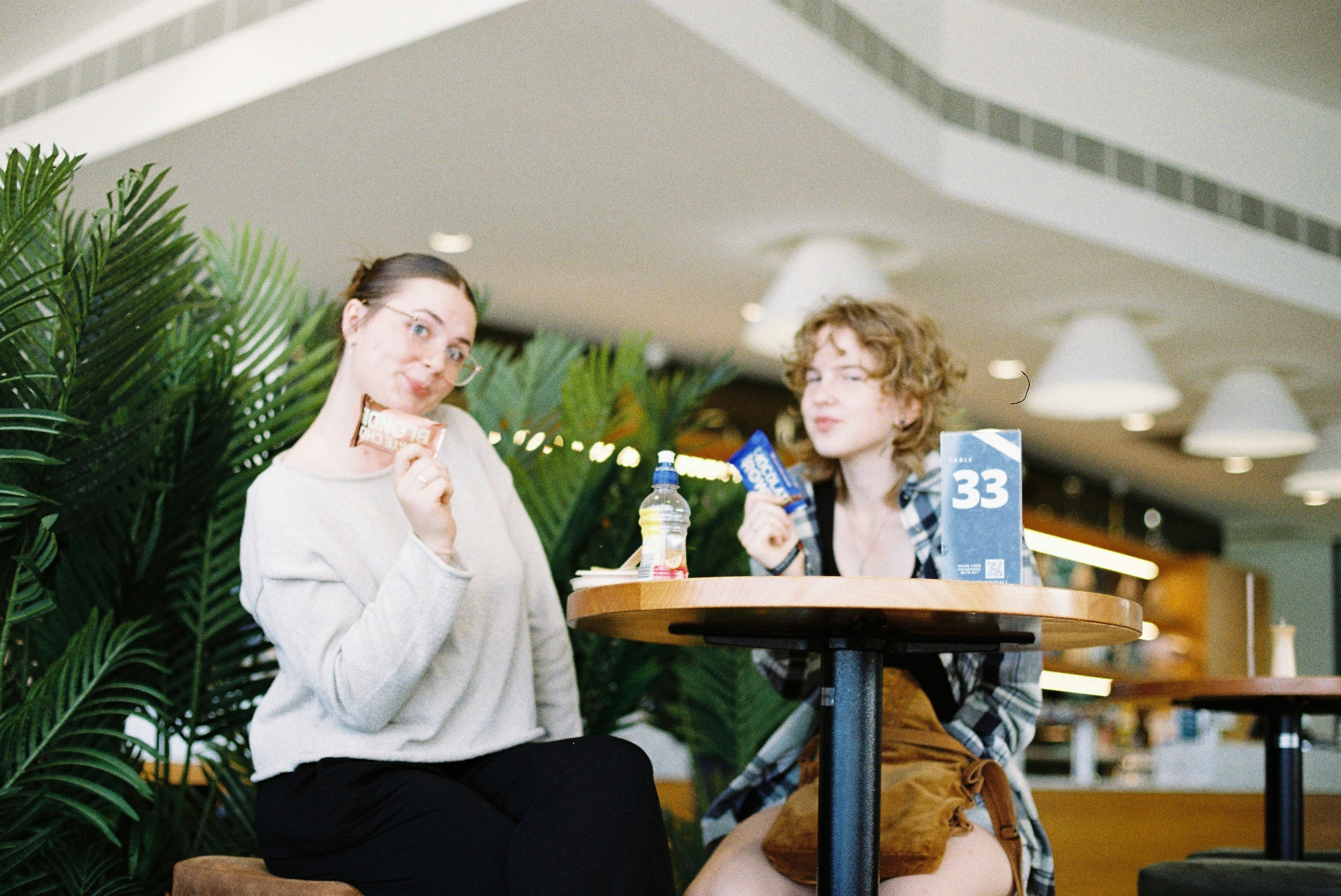 Cafe Quiet Between Flavors: Friends Share a Snack Break