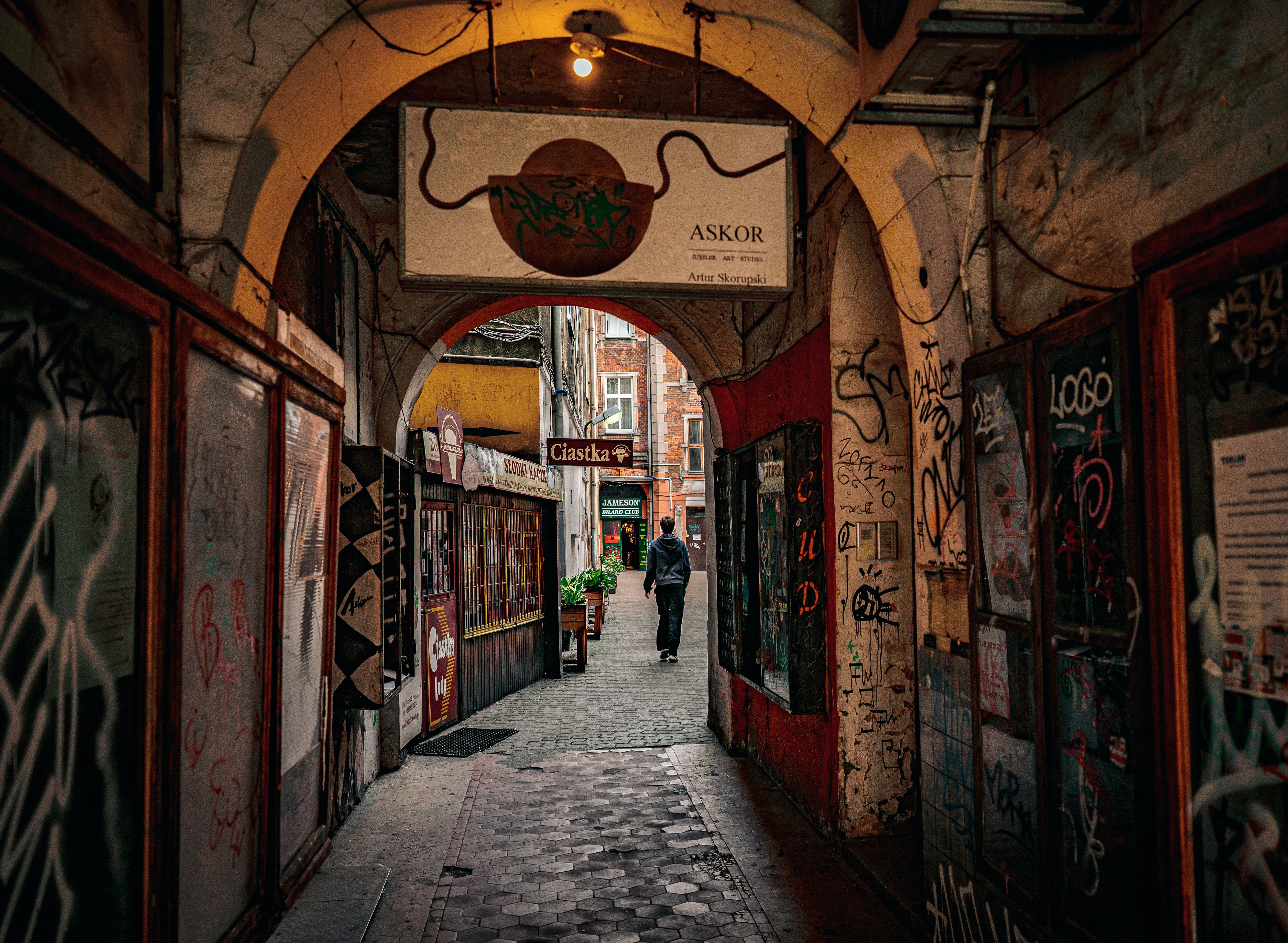 Archway into a Graffiti-Soaked Lane