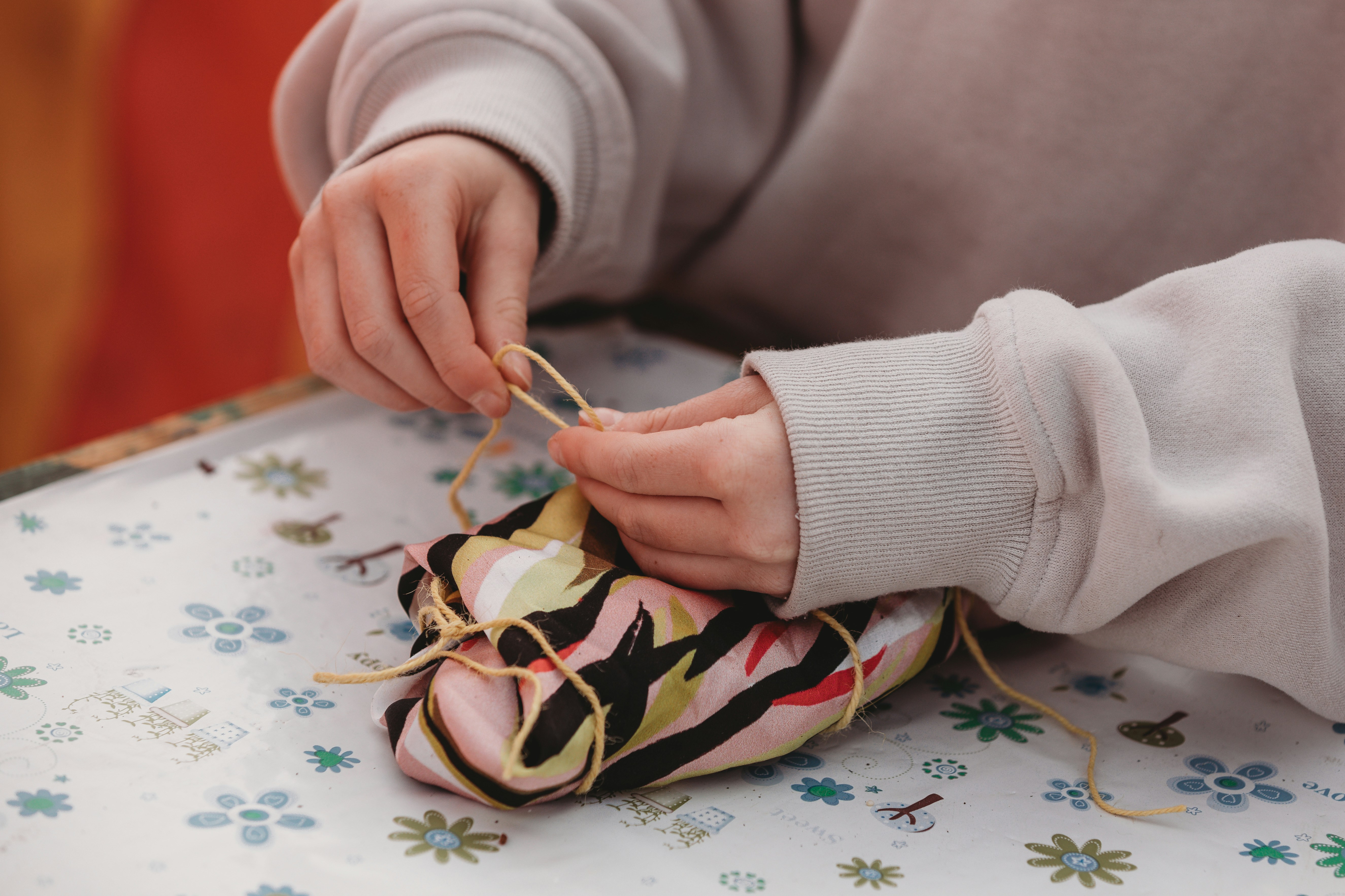 Crafting with Gentle Hands: Tying Floral String on a Padded Object