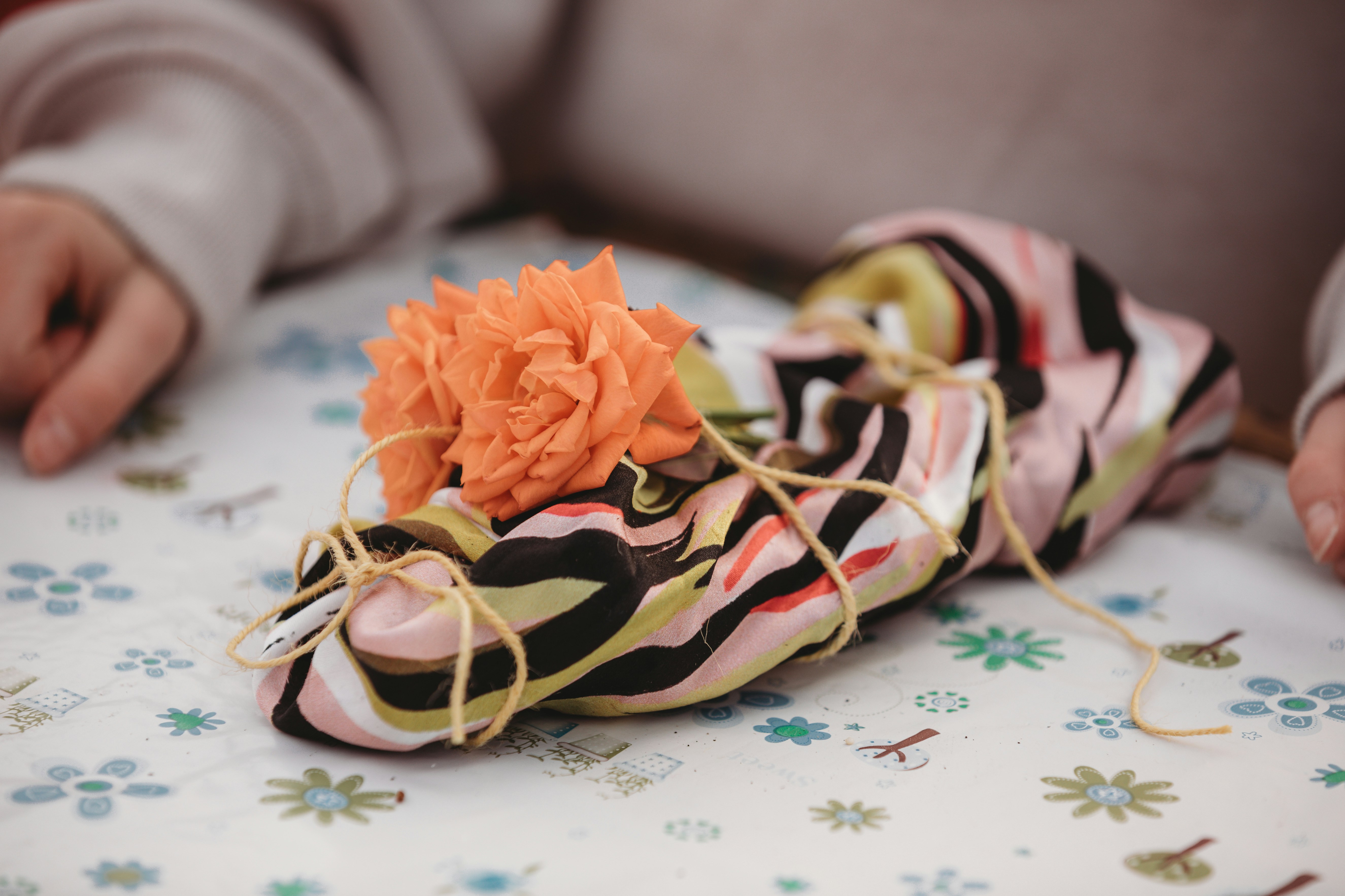 Pressed Floral Slipper: A Crafty Moment on a Patterned Table