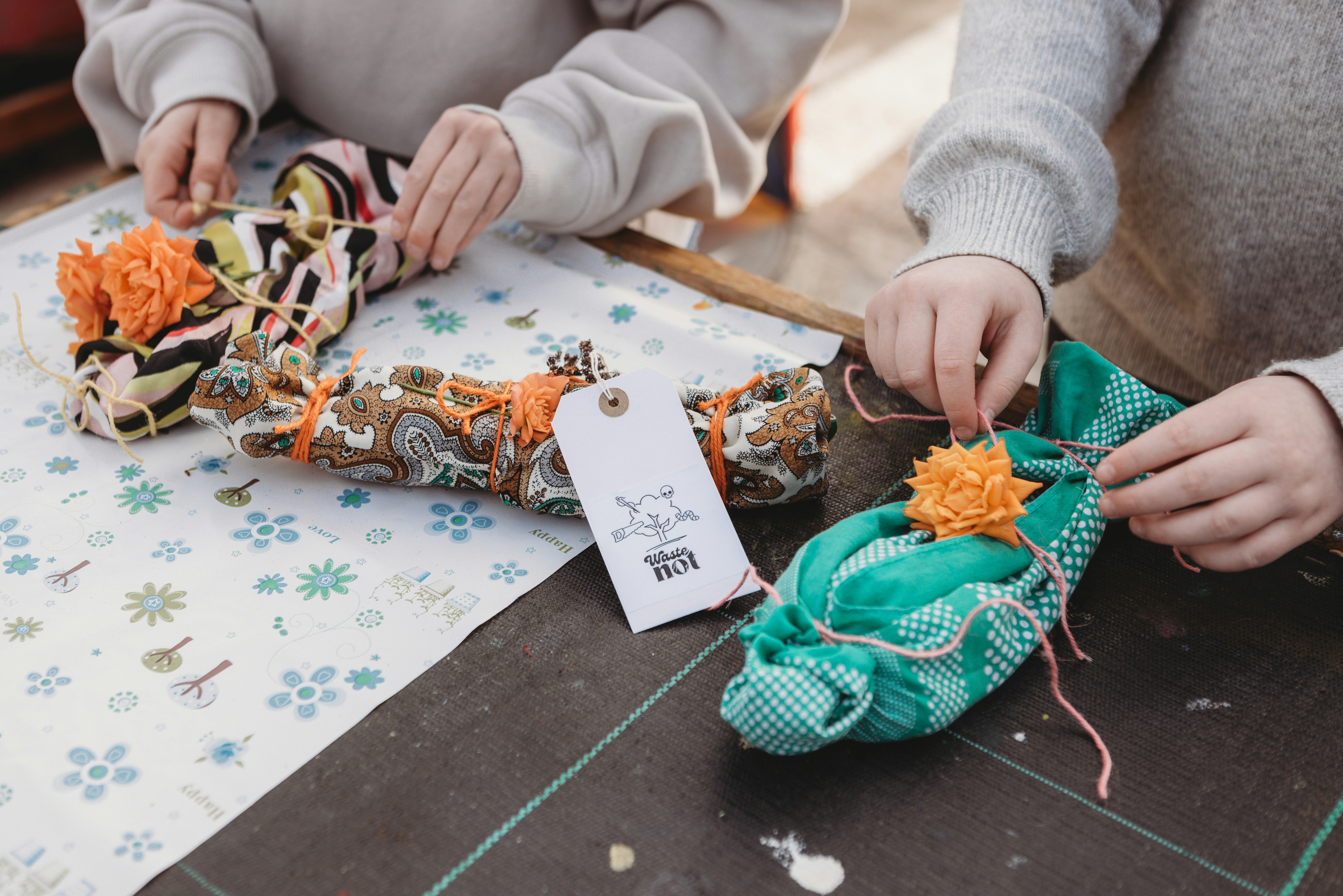 Wrapped Crafting Charms on a Wooden Table
