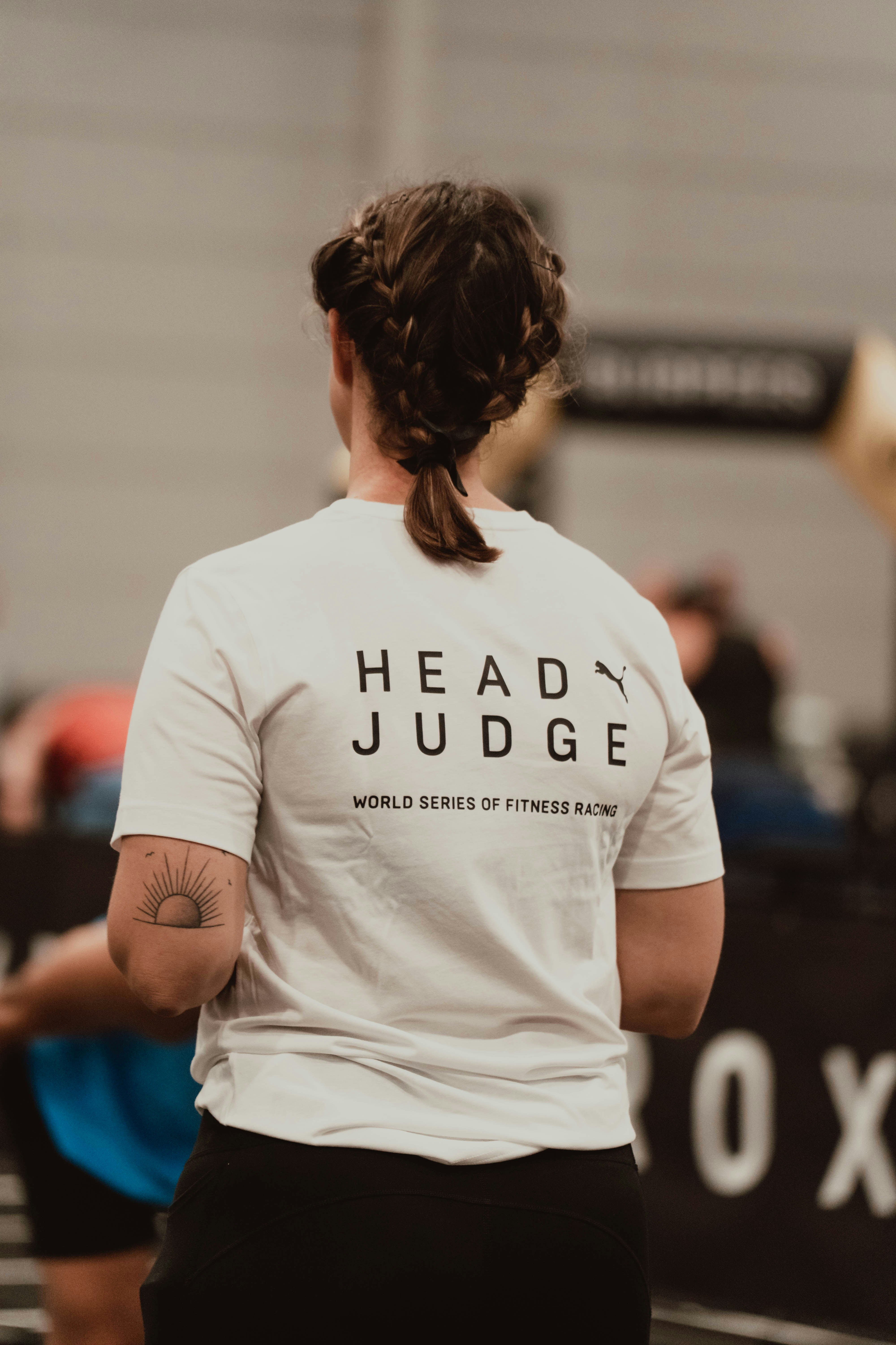 Back View of a 'Head Judge' at a Fitness Race Event