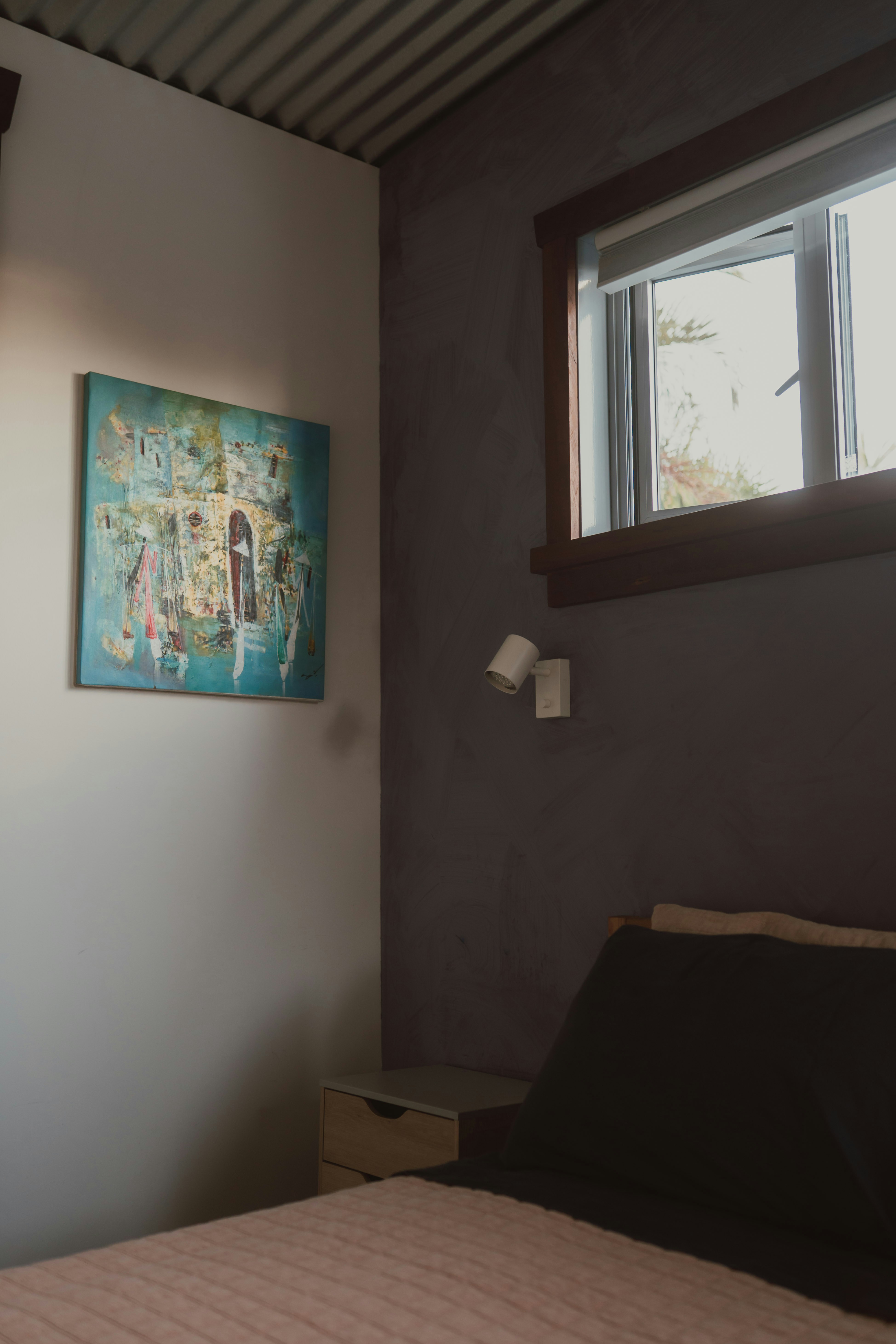 Quiet Comfort: A Corner of Art and Light in a Painted Bedroom