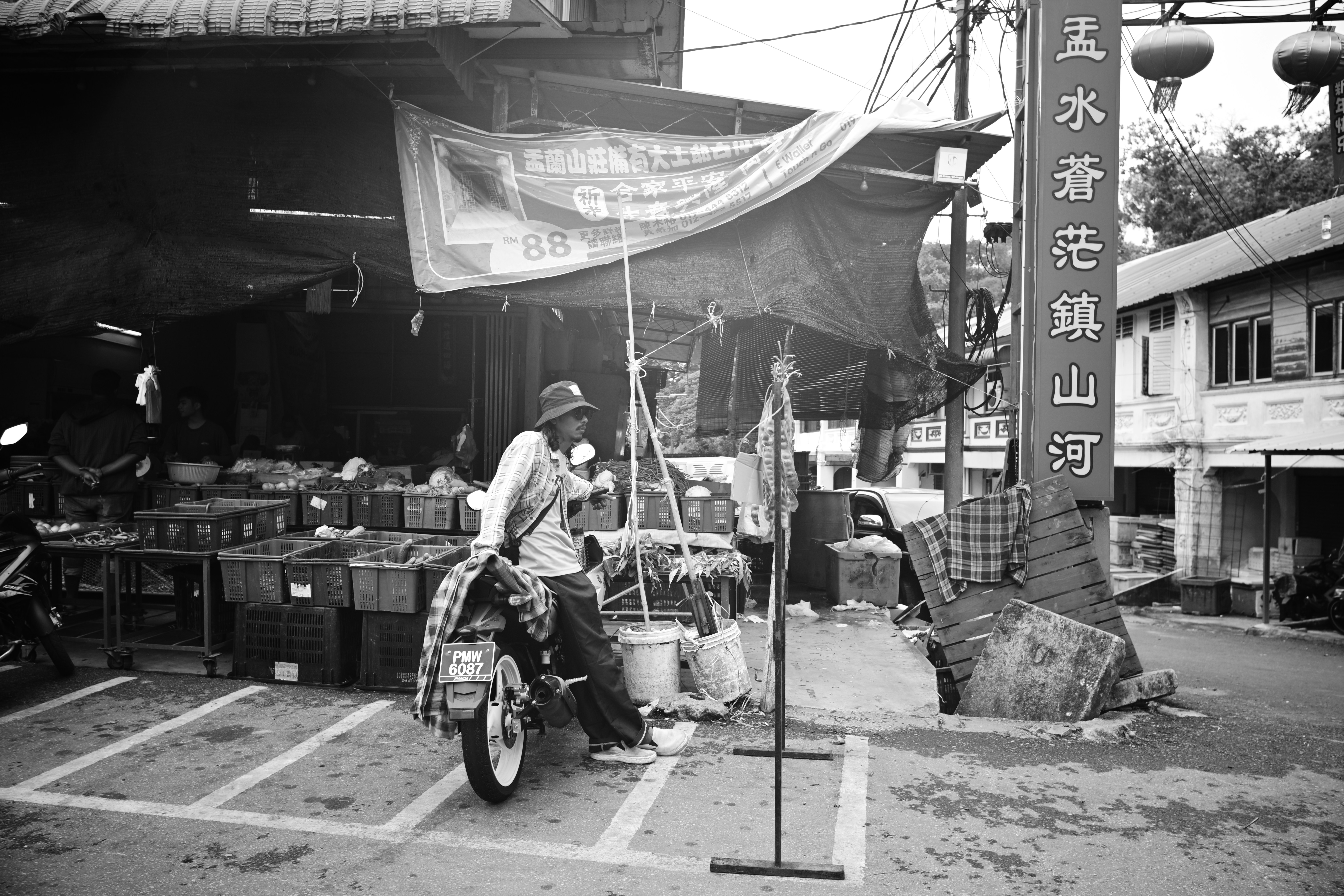 Motorcycle Messenger at a Hum of a Chinese Market