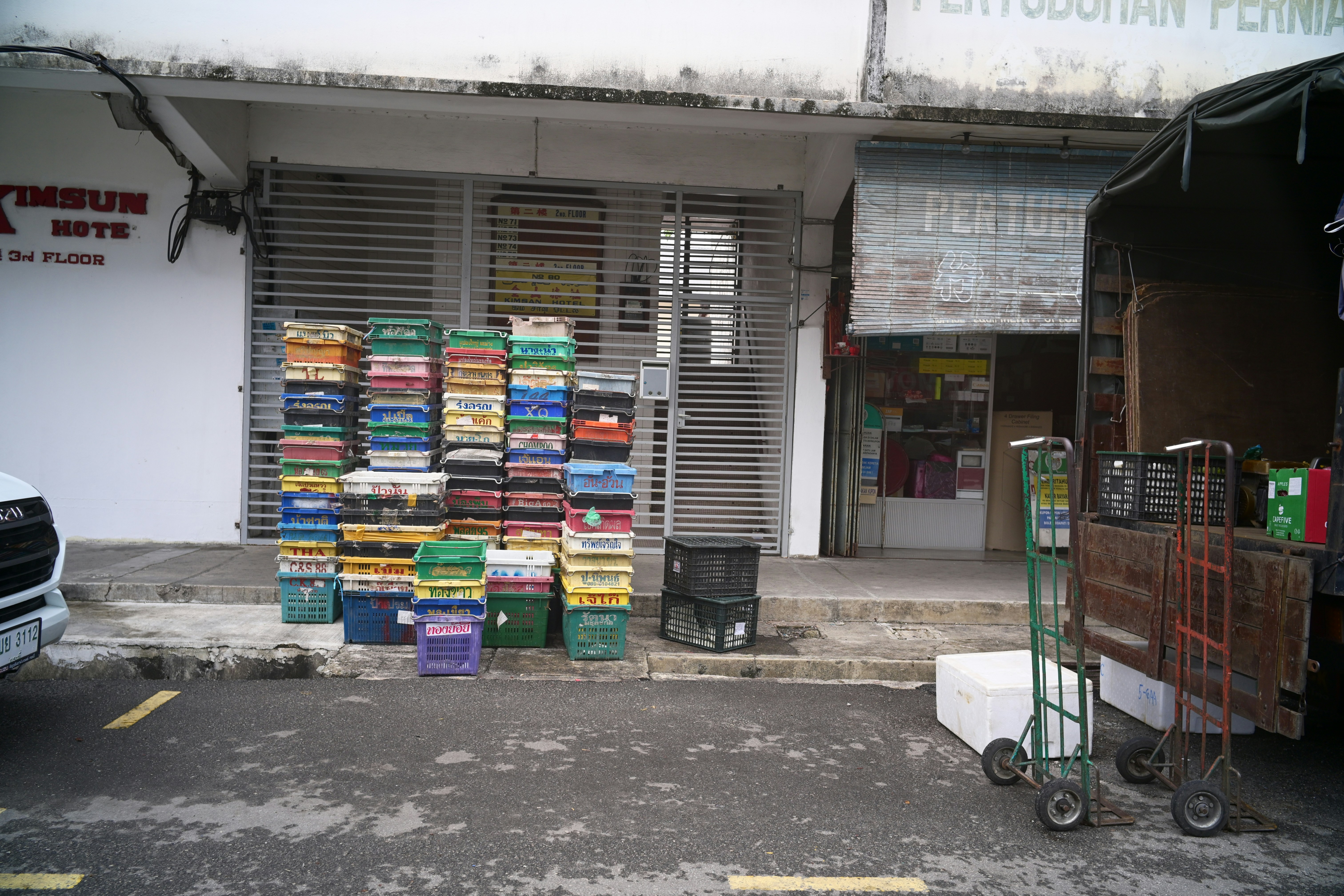 Stacks of color at a small market storefront