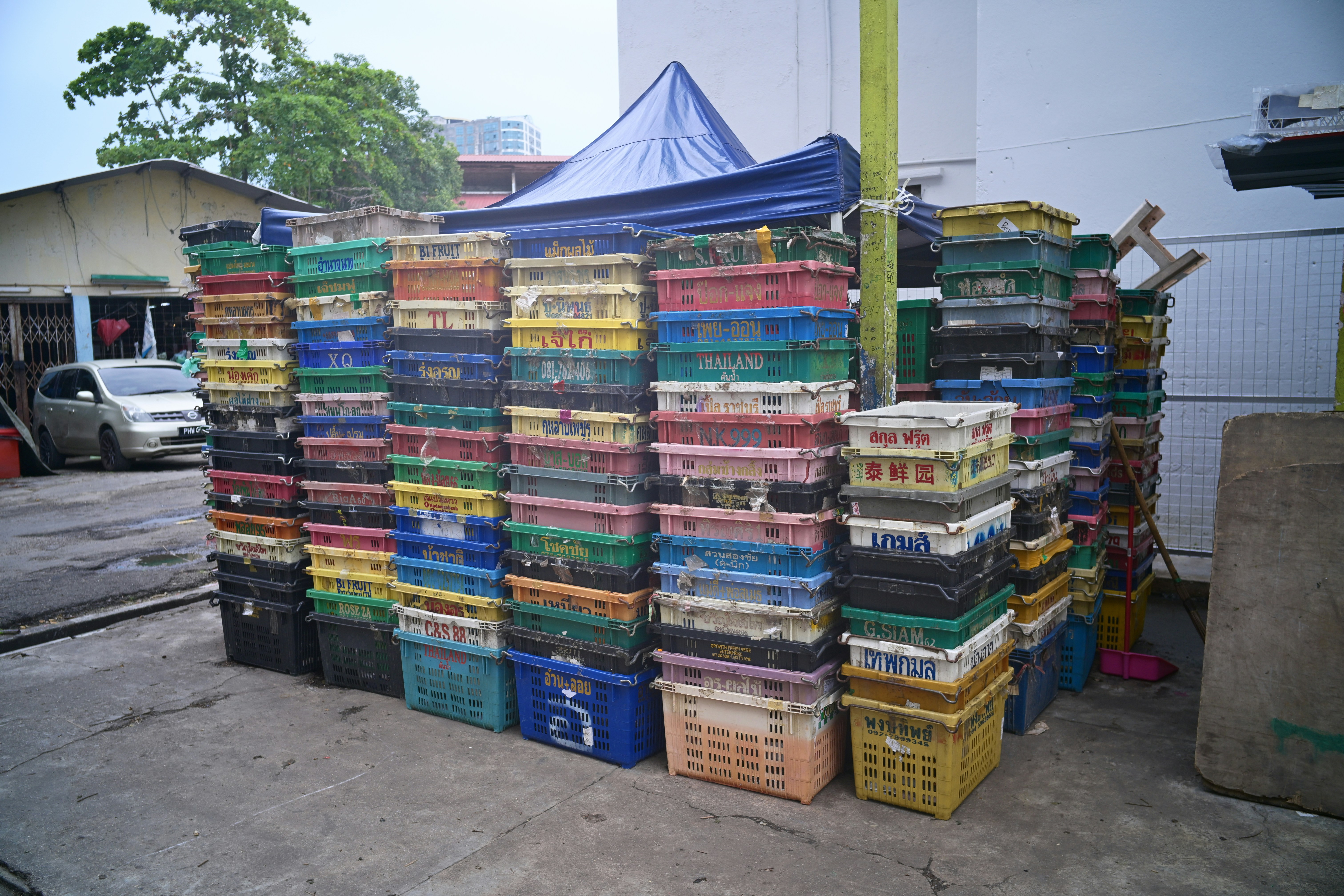 Stacks of Crates Under a Bright Canopy