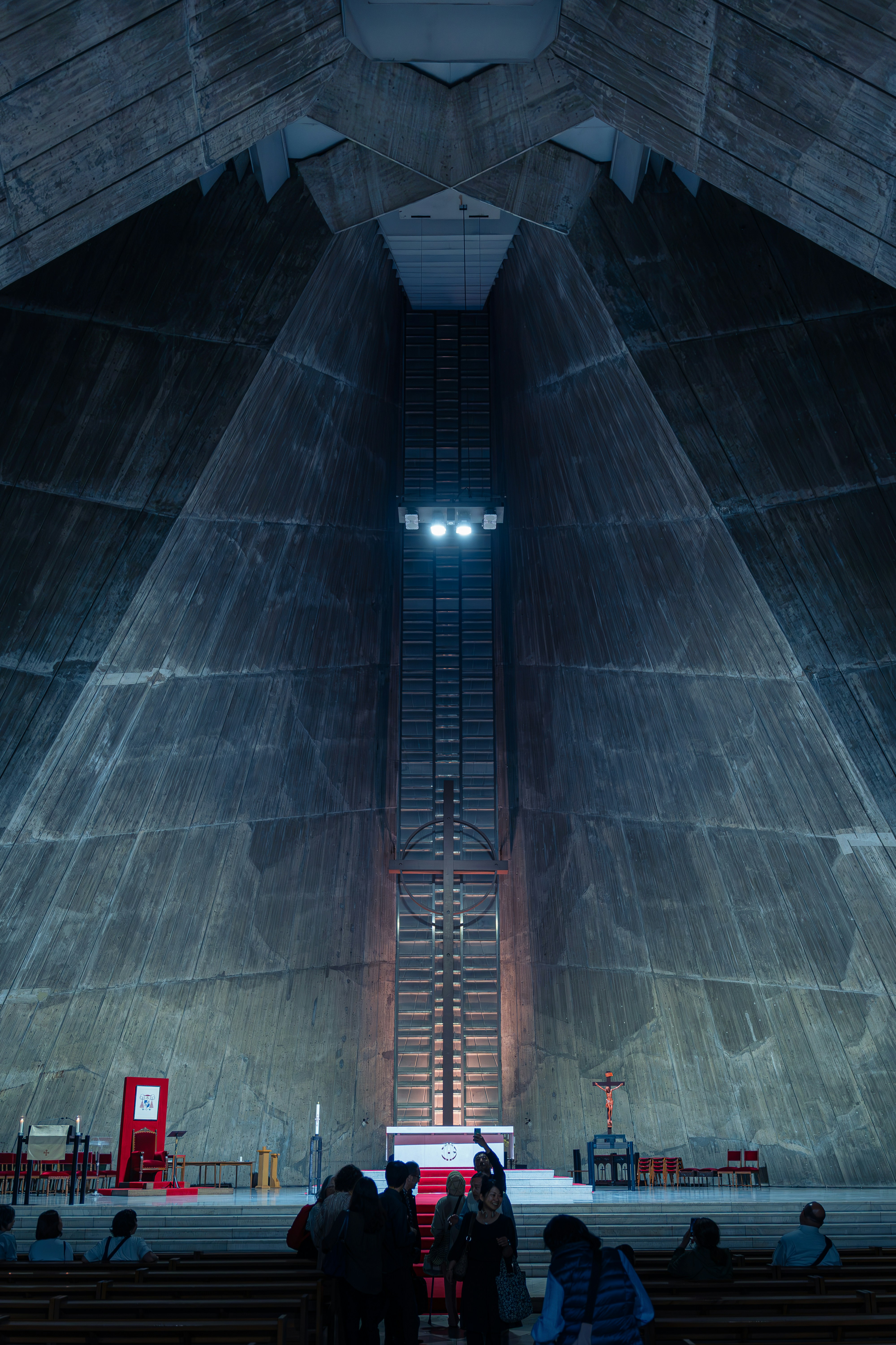 The Dark Vault: A Concrete Cathedral with People in Silence