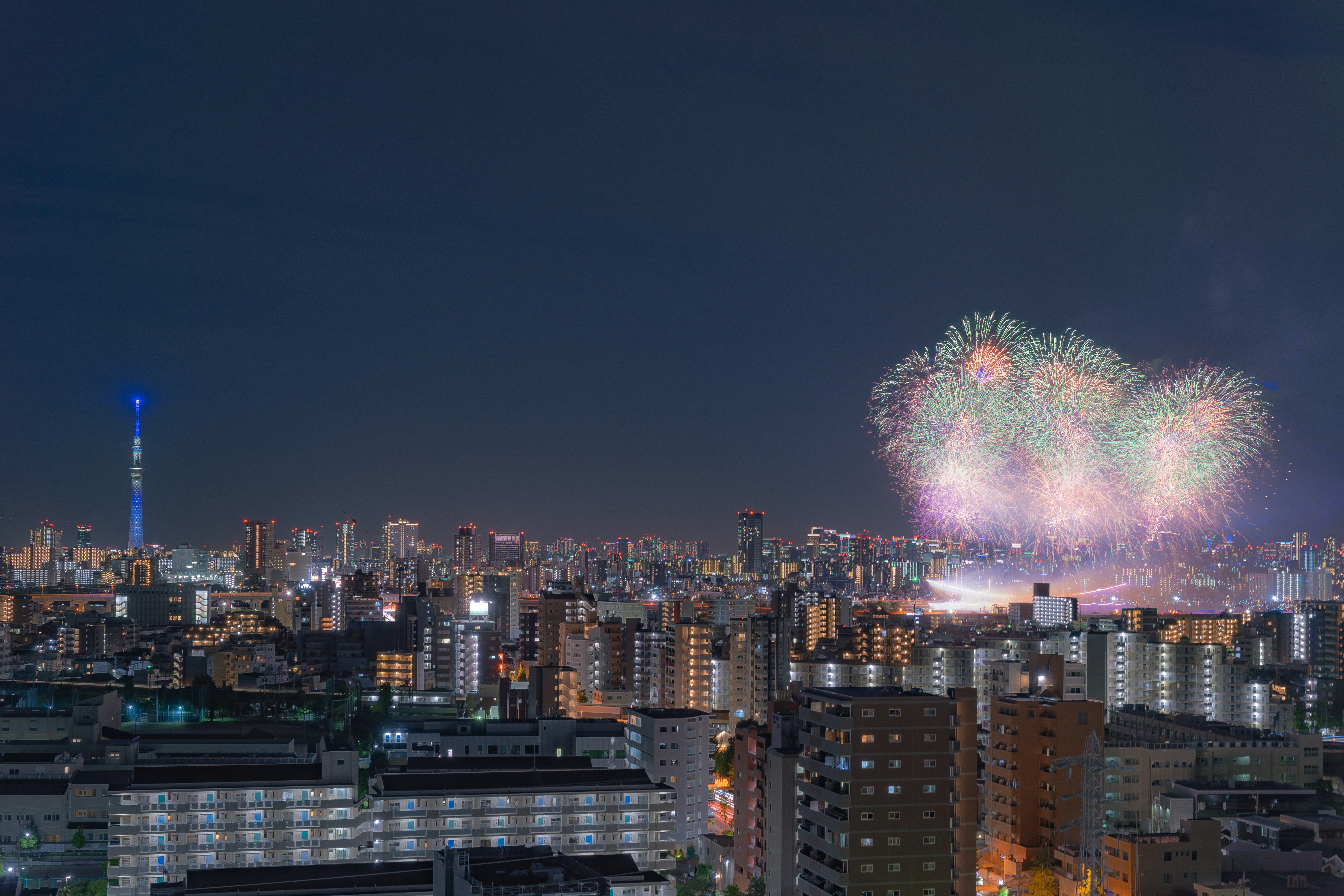 City Skyline Ambient: Fireworks Over a Night Cityscape