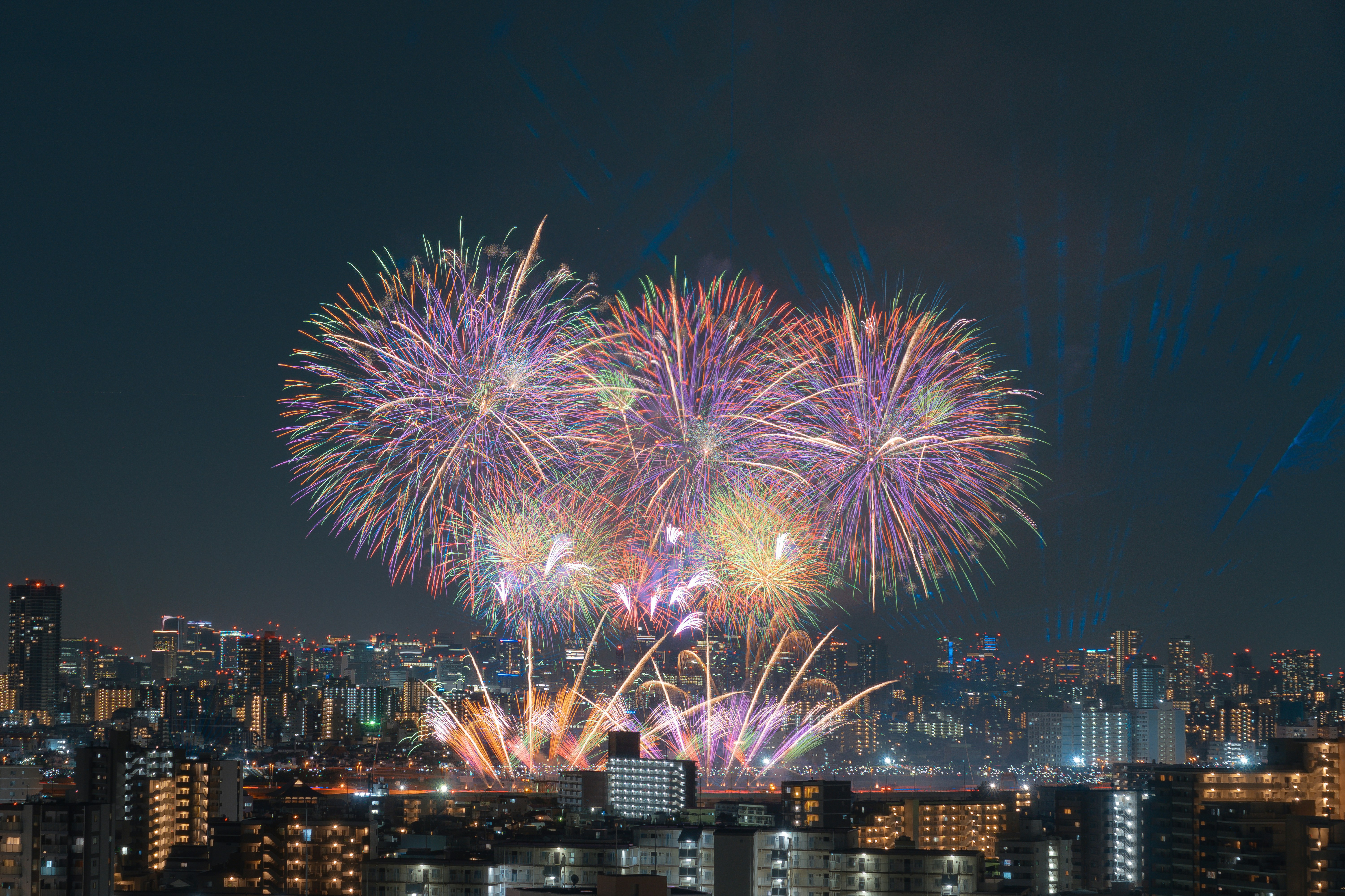 City in Bloom: Fireworks Over a Nighttime Horizon
