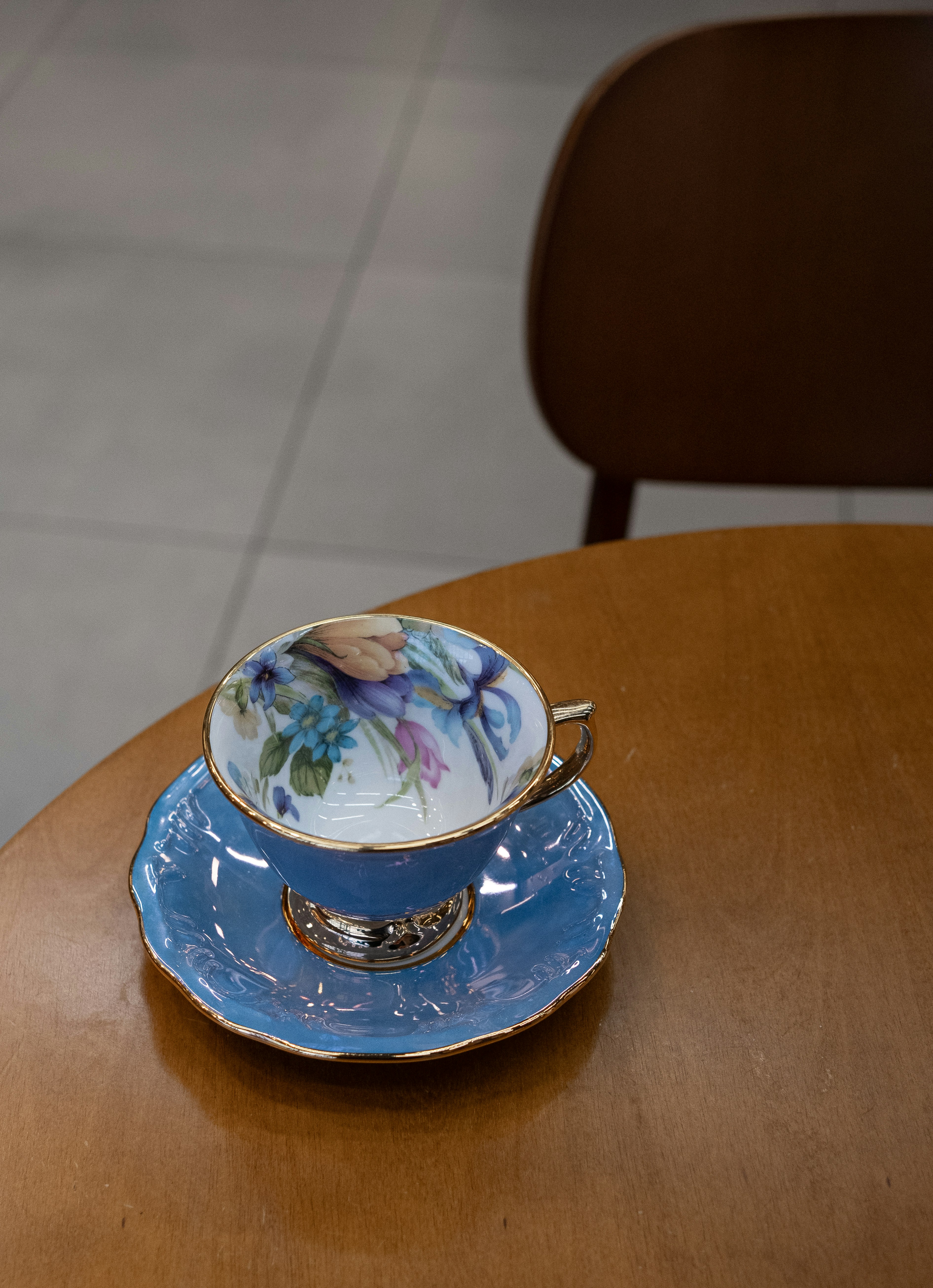 Blue Wedgwood Cup on a Warm Wooden Table