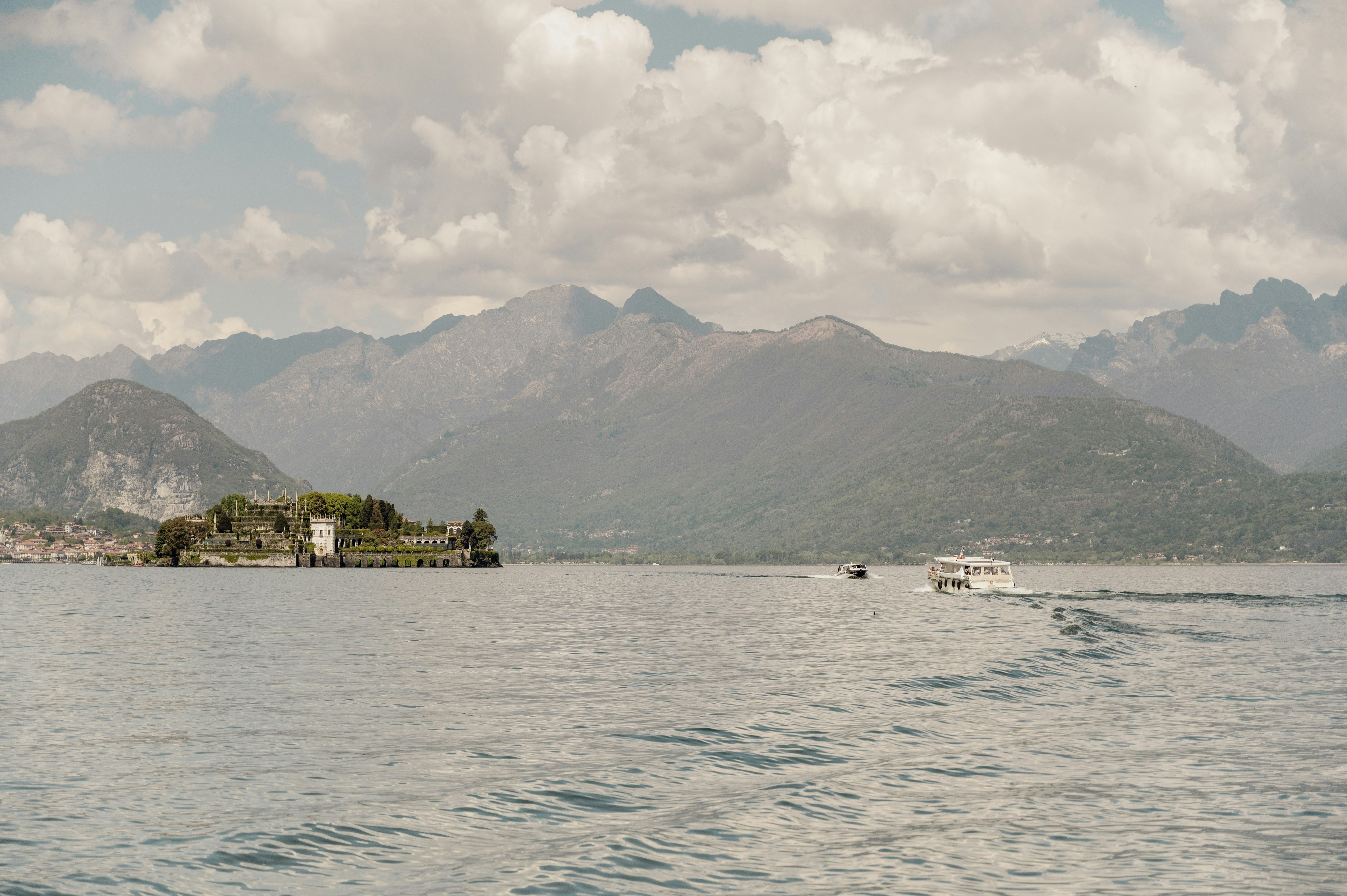 Castle Island on lapping waters beneath alpine turmoil