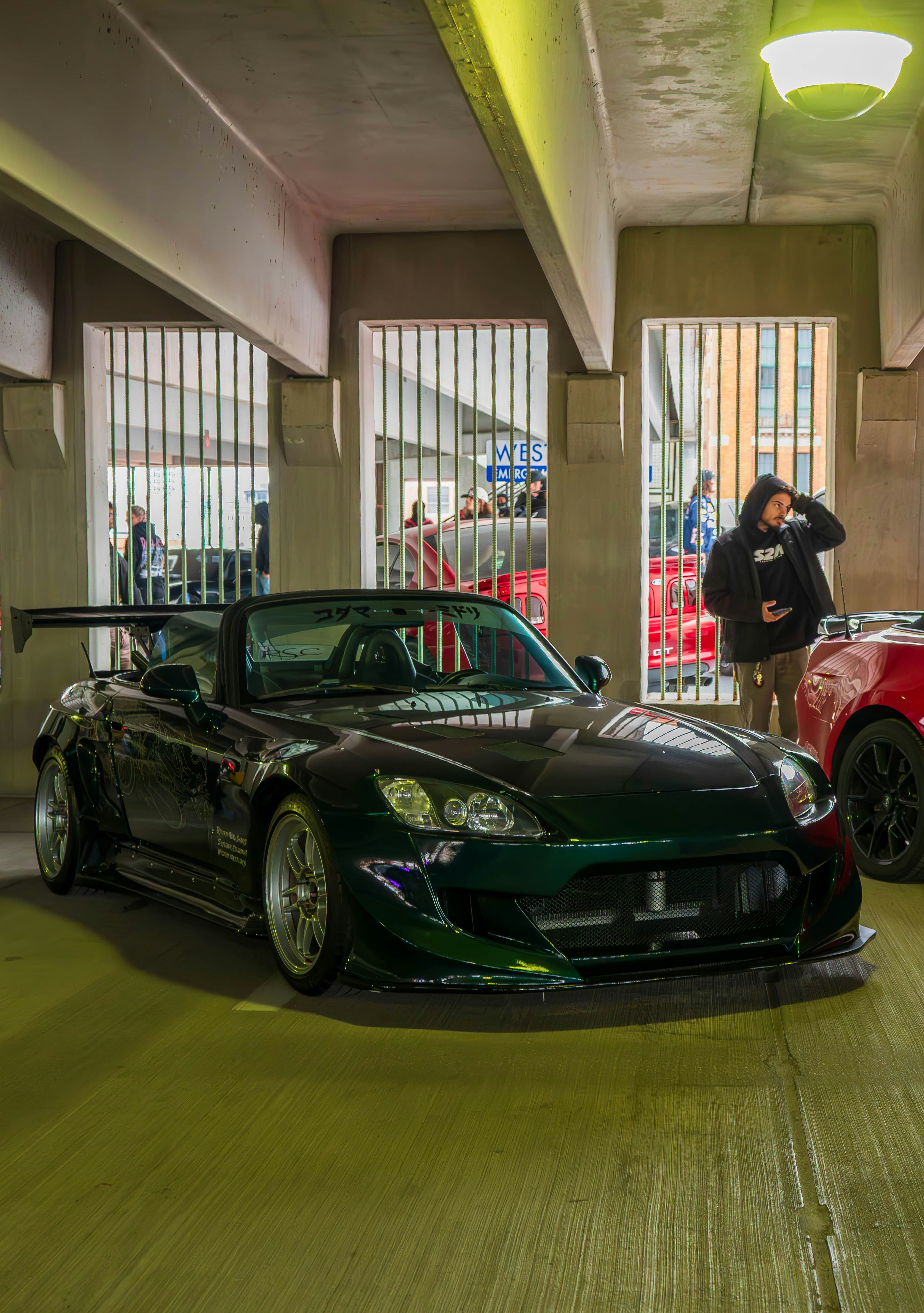 Low-Slung Silence: A Dark Toyota-Demon Under Neon in a Parking Garage