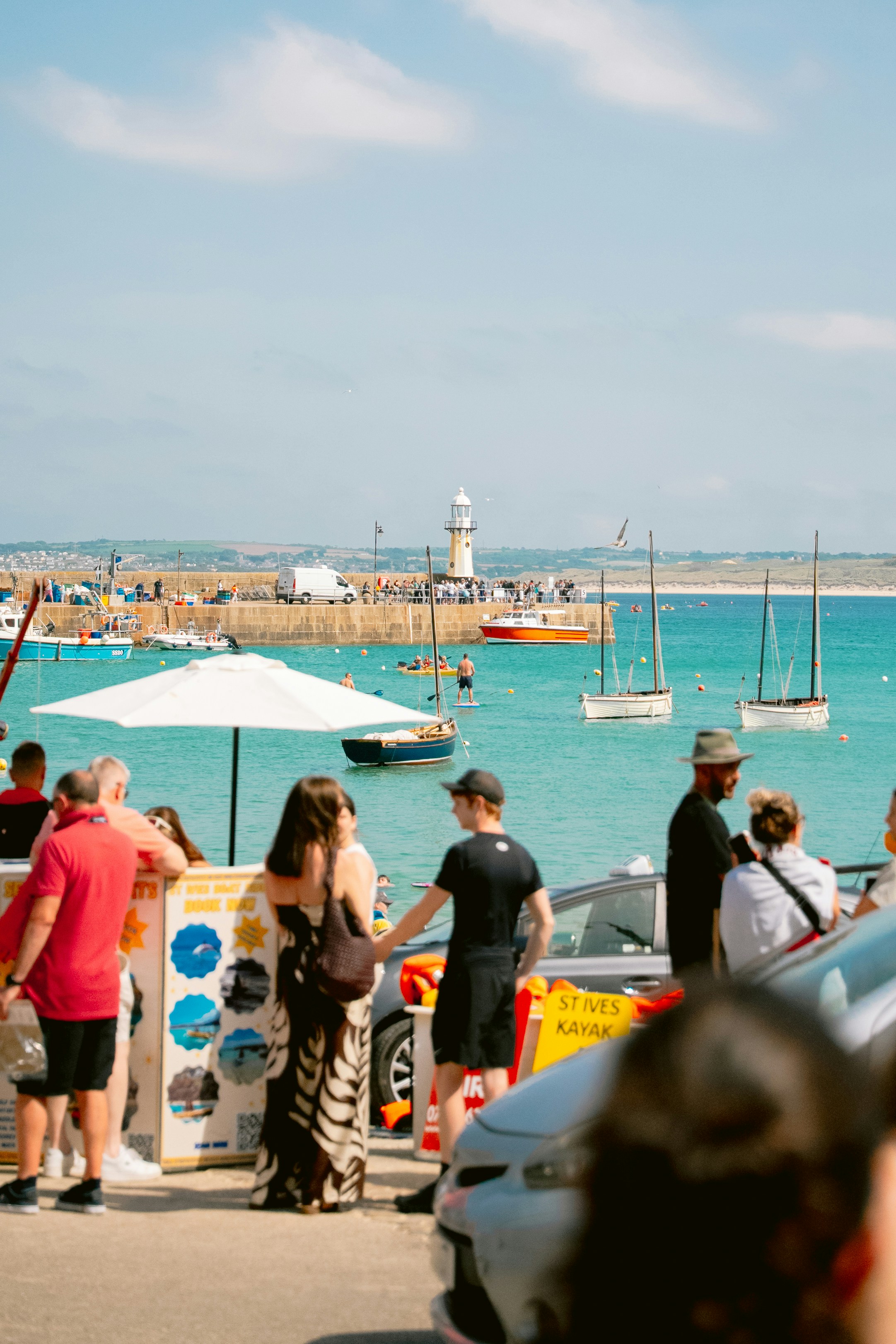 Harbor Crowd at Distant Lighthouse