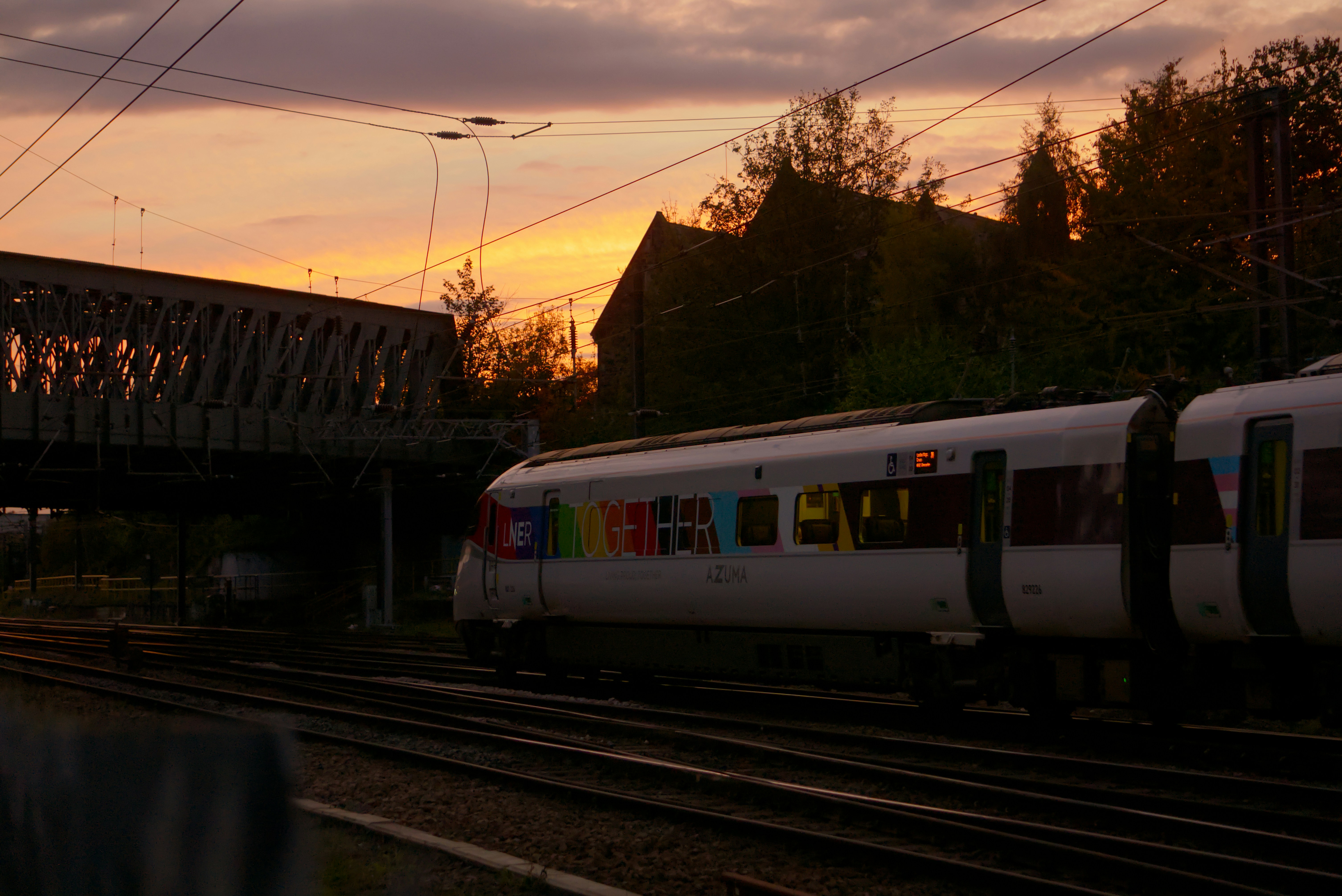 Twilight Commuter: A Quiet Platform Brushed by a Moving Train
