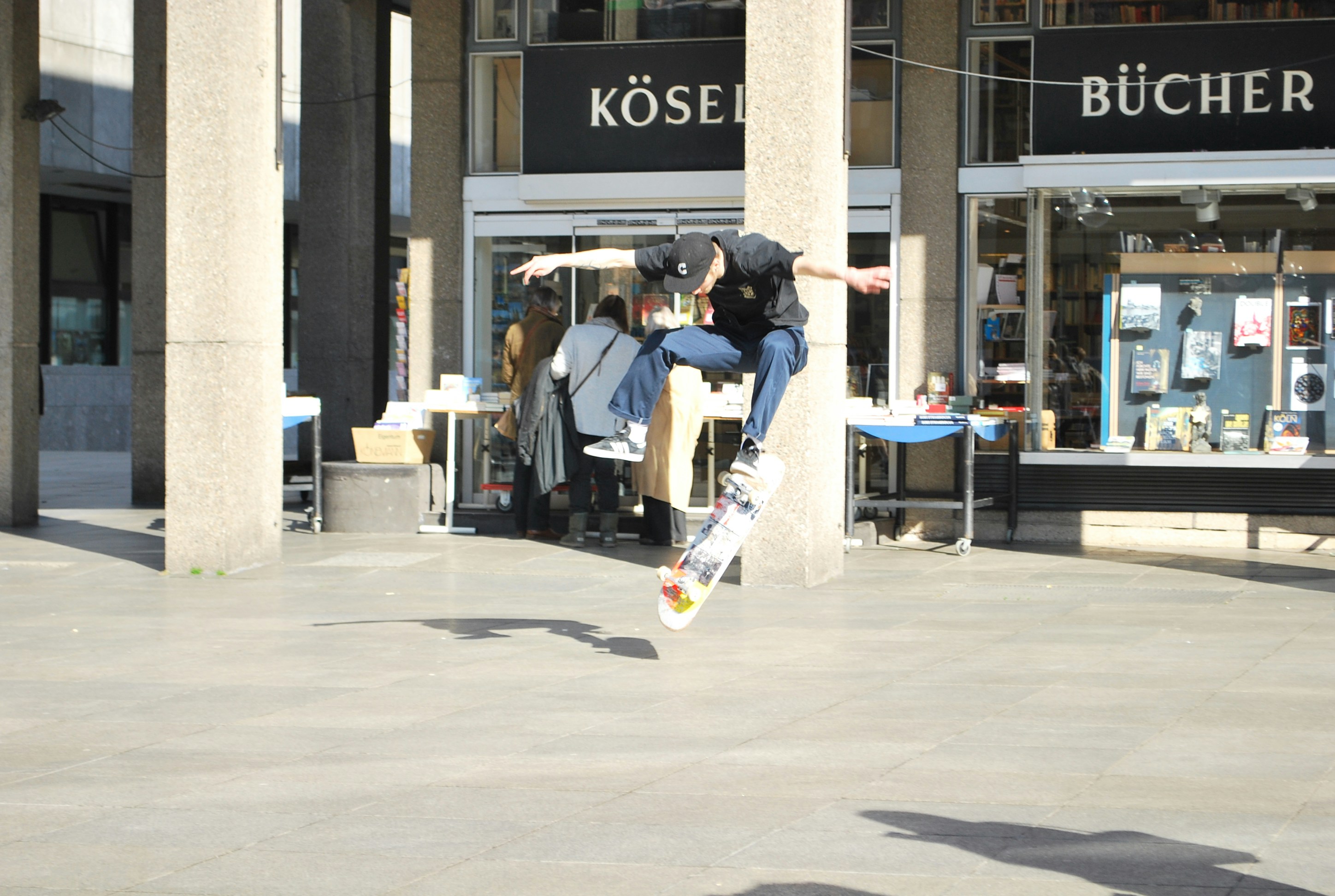 Center Jump: Skateboarder Flies Across a City Square
