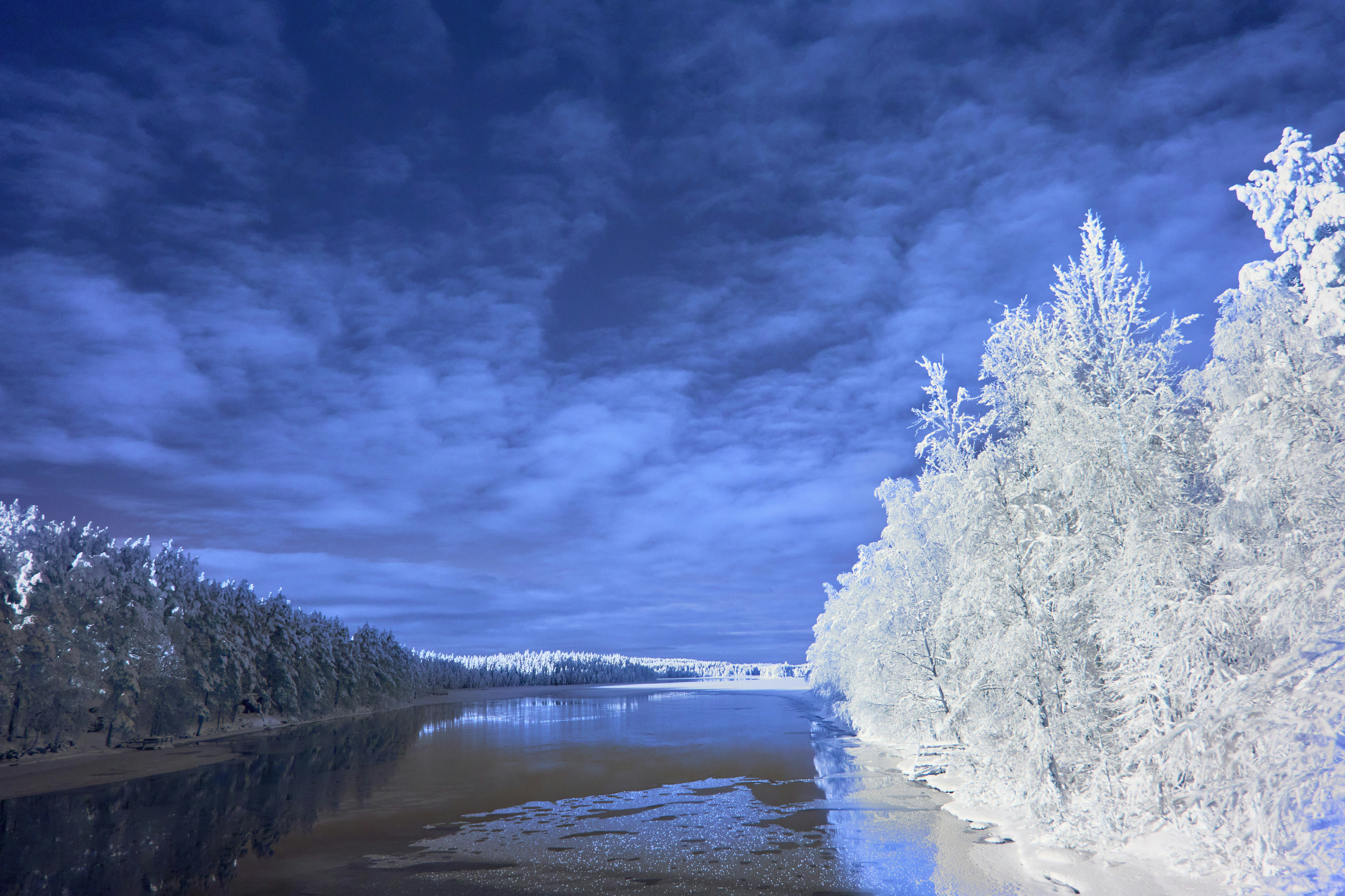 Icy River Bend Under a Bluesky Night