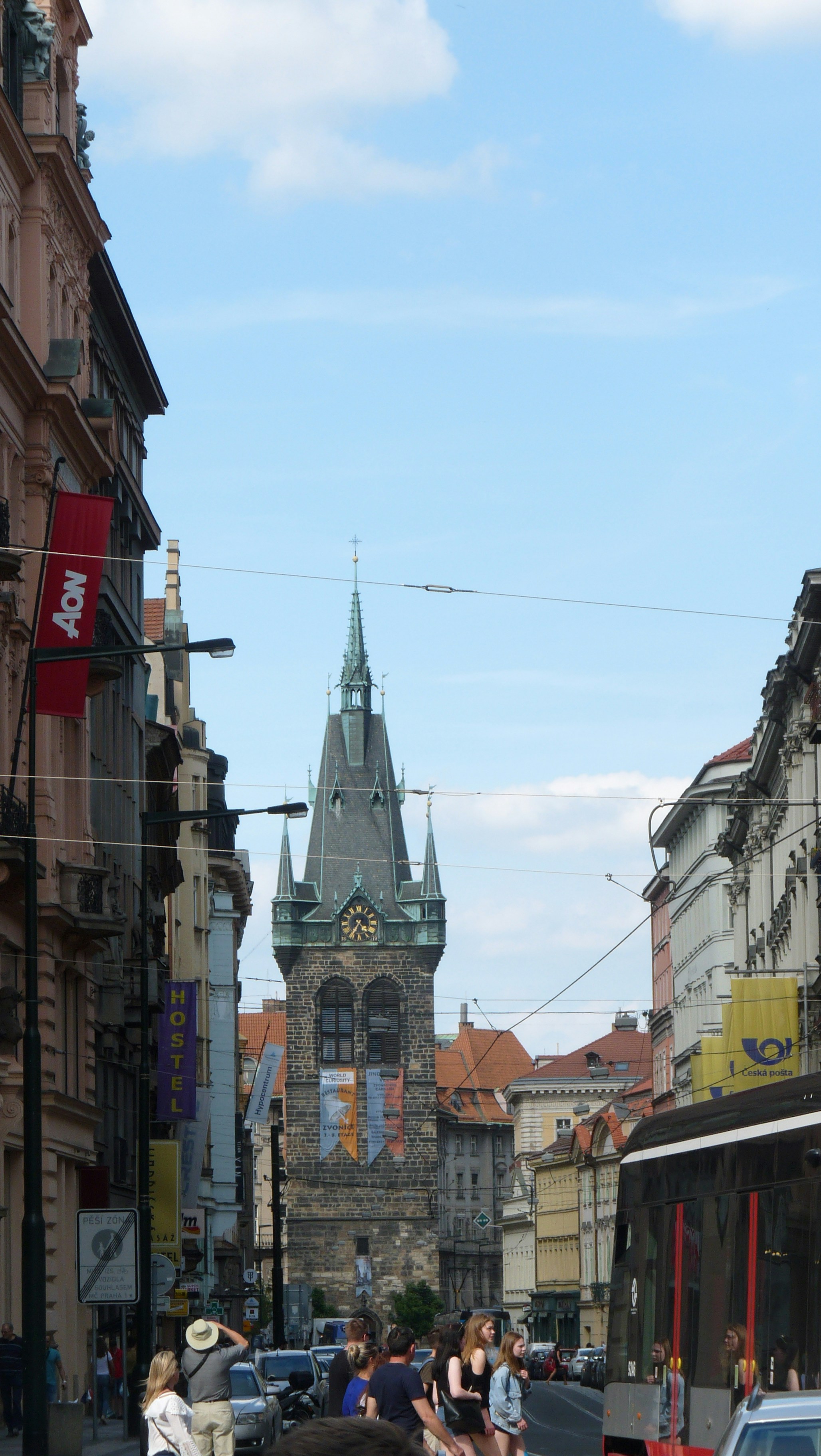 Towered Clock Tower Over a Busy European Street
