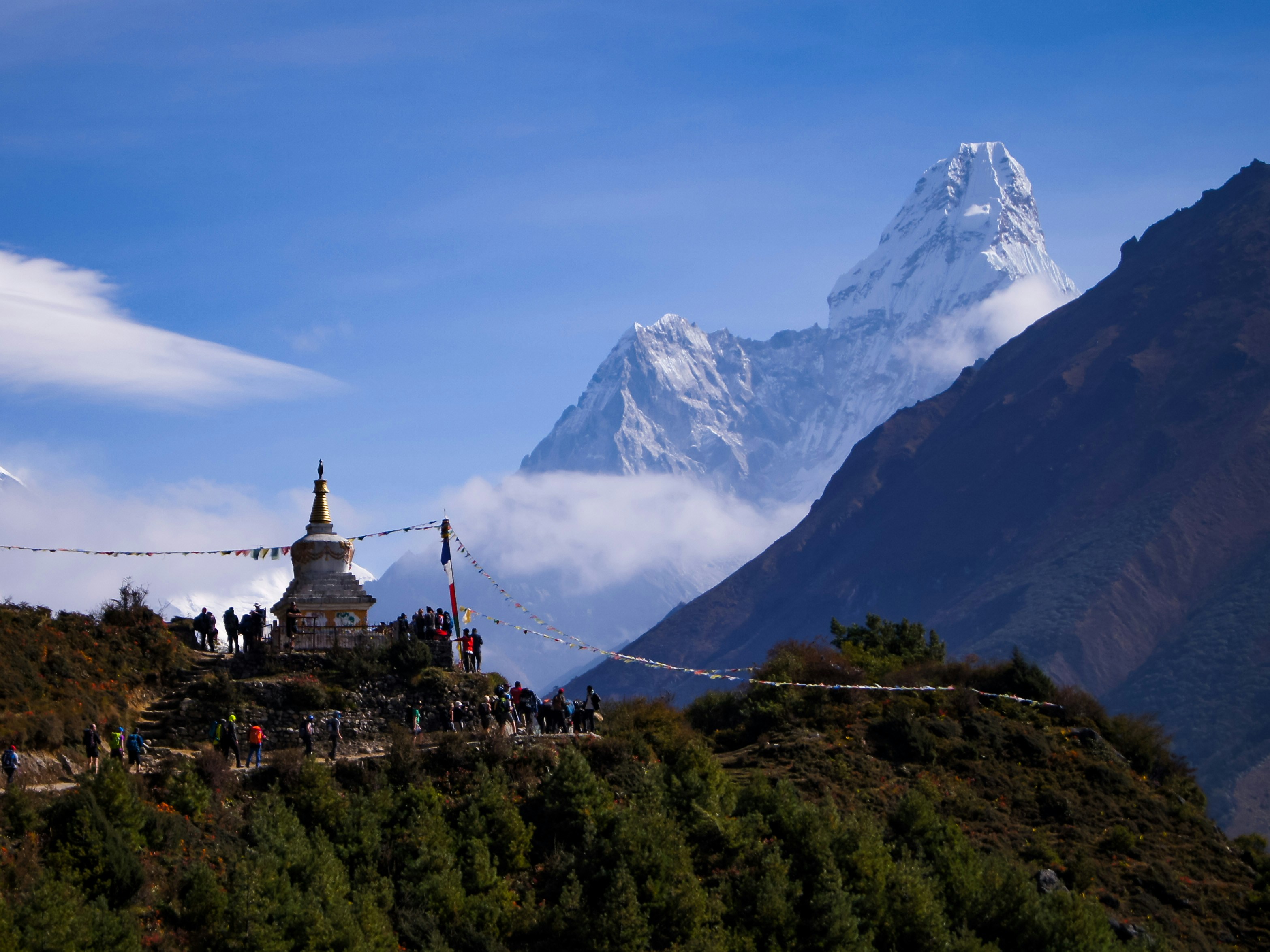 Prayer Flags and Snow-Capped Peaks Beyond the Ridge
